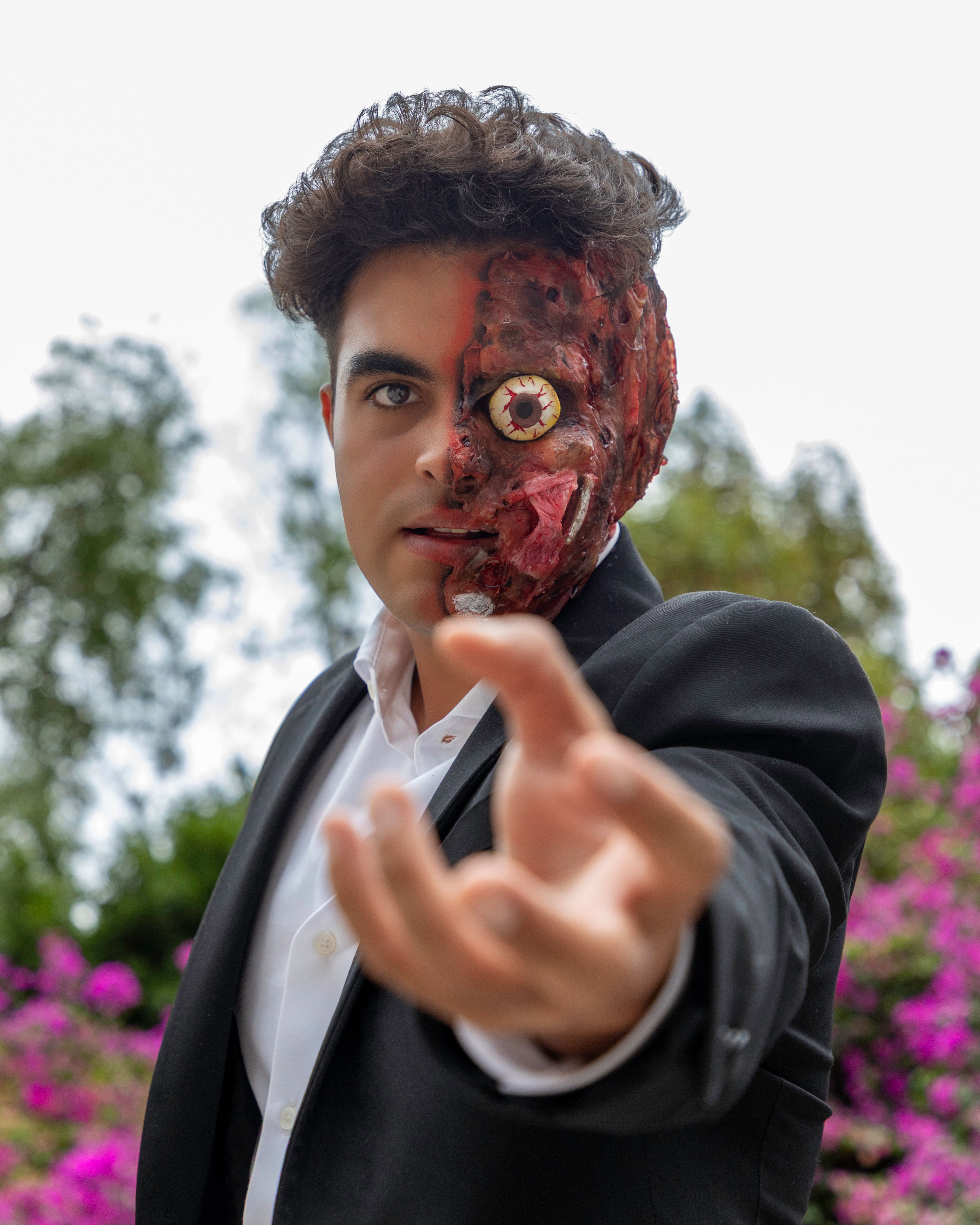 Dramatic Portrait of Man in Zombie Makeup Outdoors · Free Stock Photo