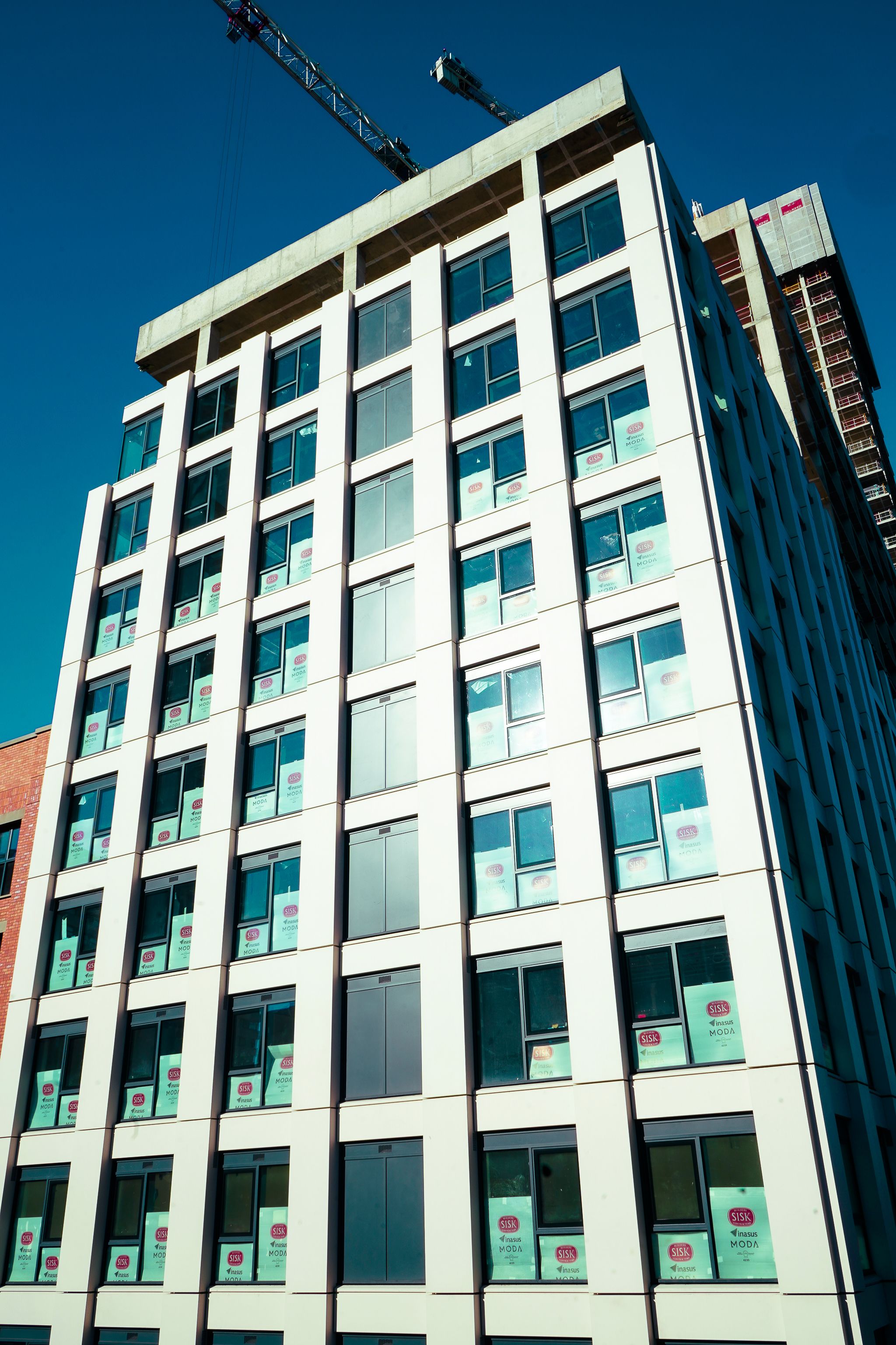 Modern High-Rise Building Under Construction · Free Stock Photo