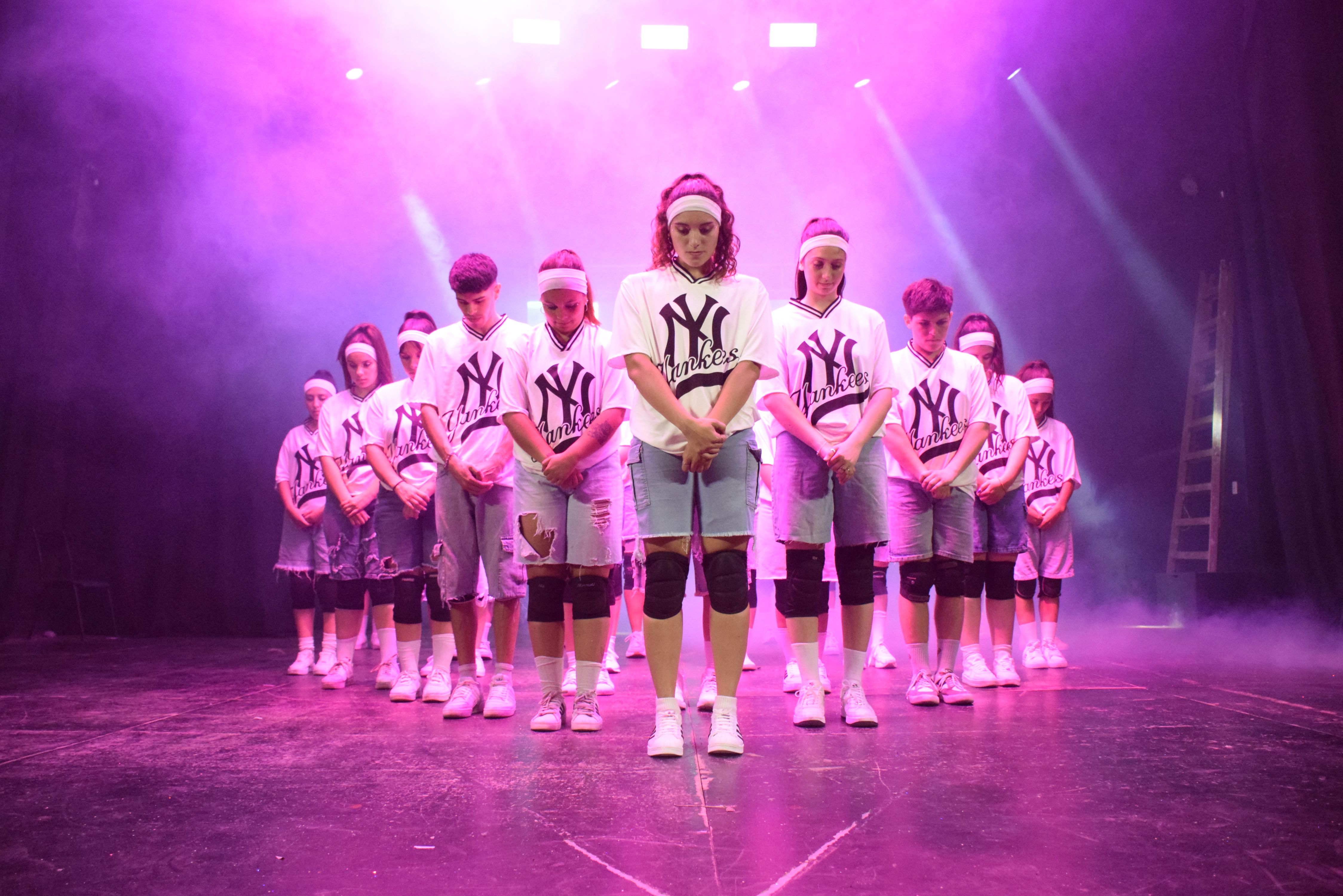 Performing Dance Crew in Uniform on Stage · Free Stock Photo