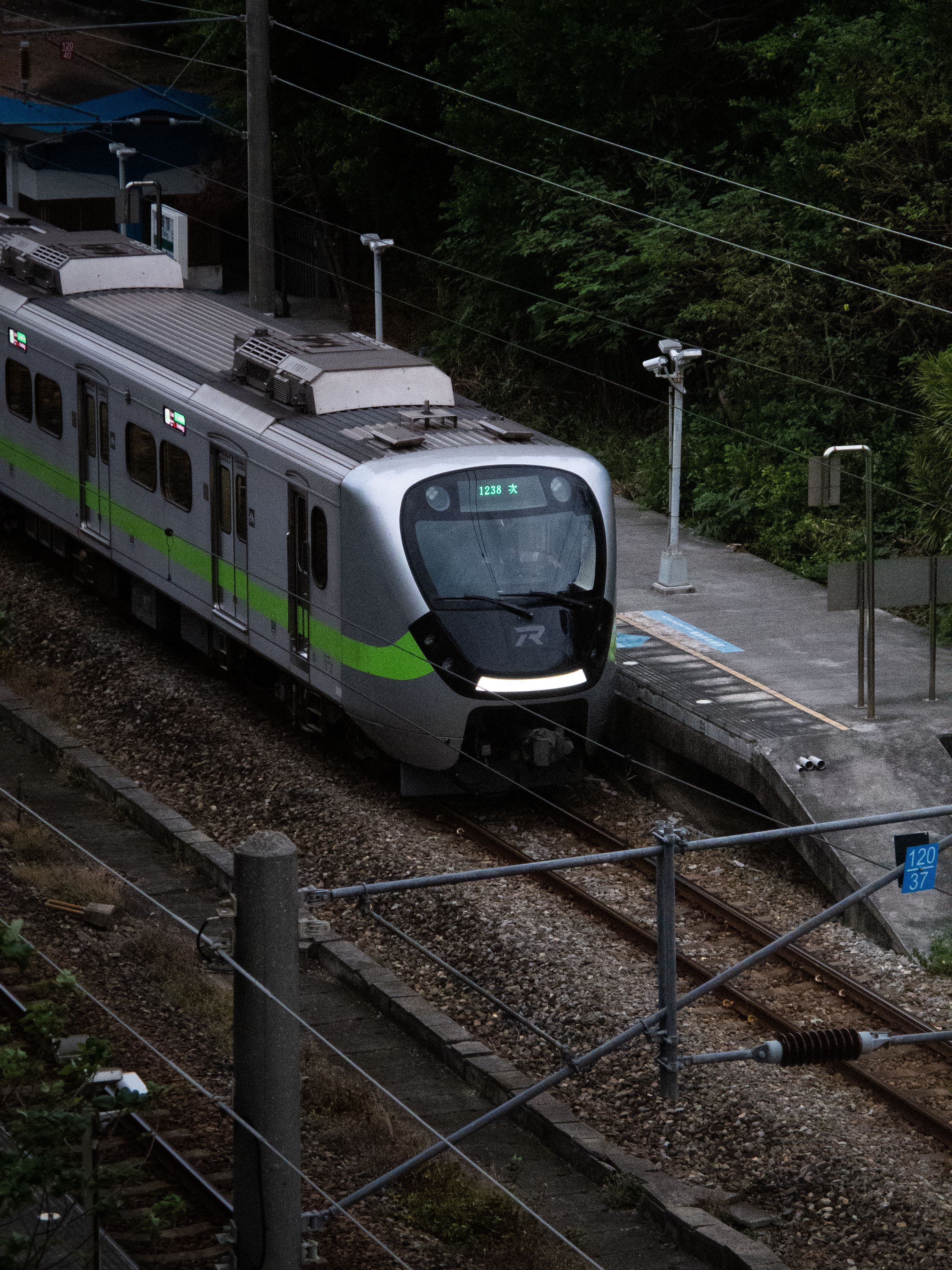 Modern Electric Train Approaching Station · Free Stock Photo