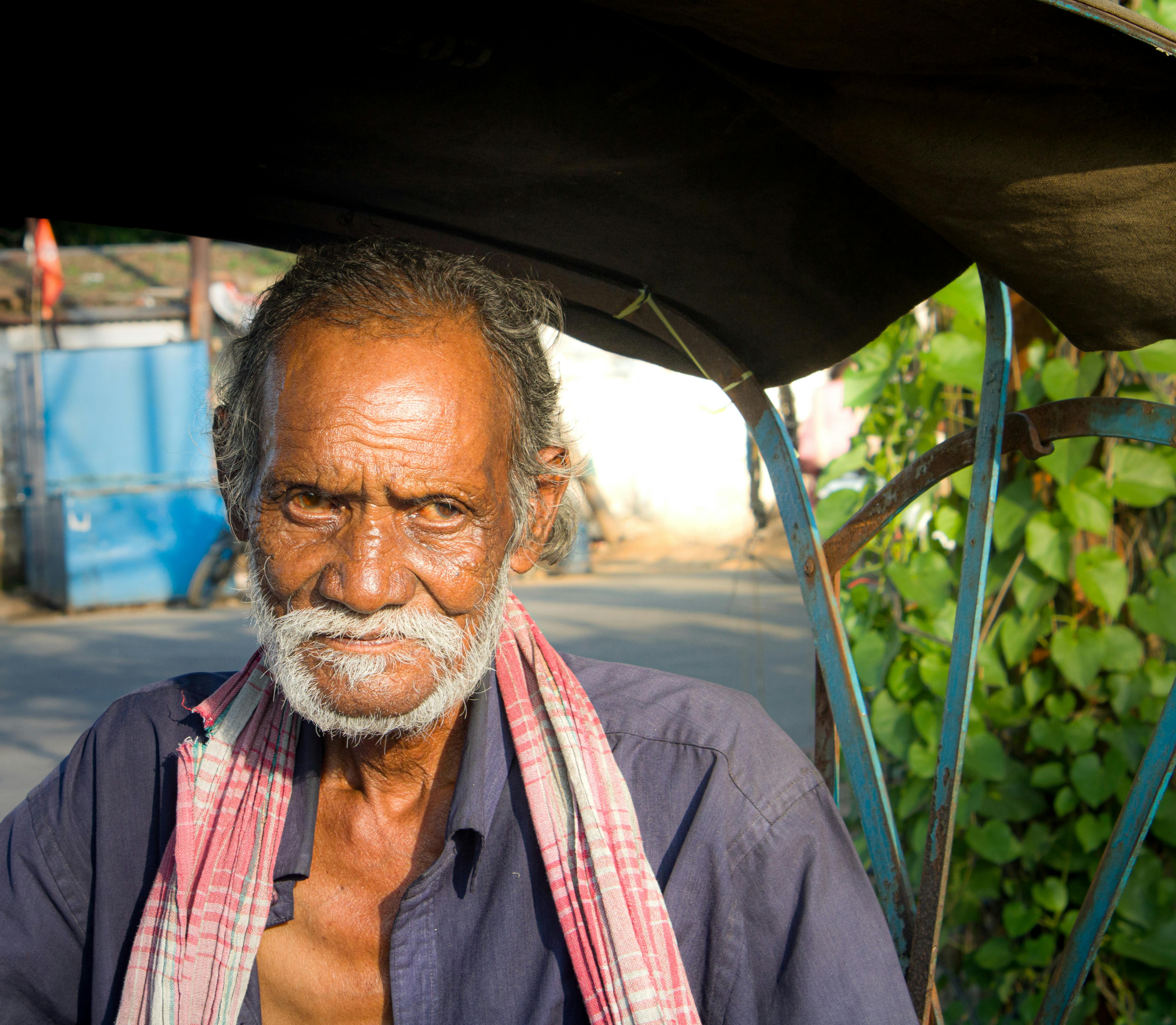 Elderly Man in Rickshaw under Sunlight · Free Stock Photo
