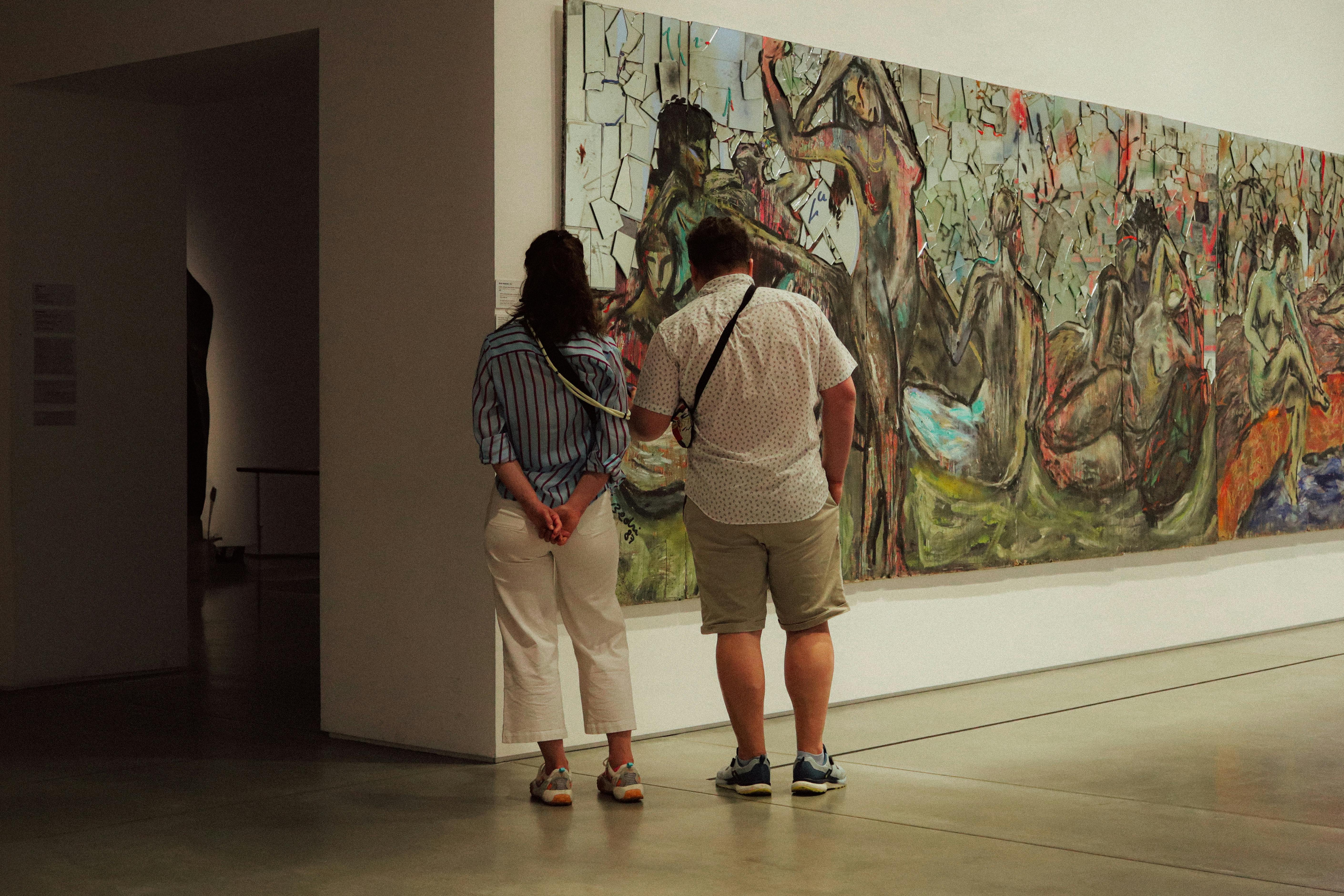 Art Enthusiasts Admiring Abstract Museum Exhibit · Free Stock Photo