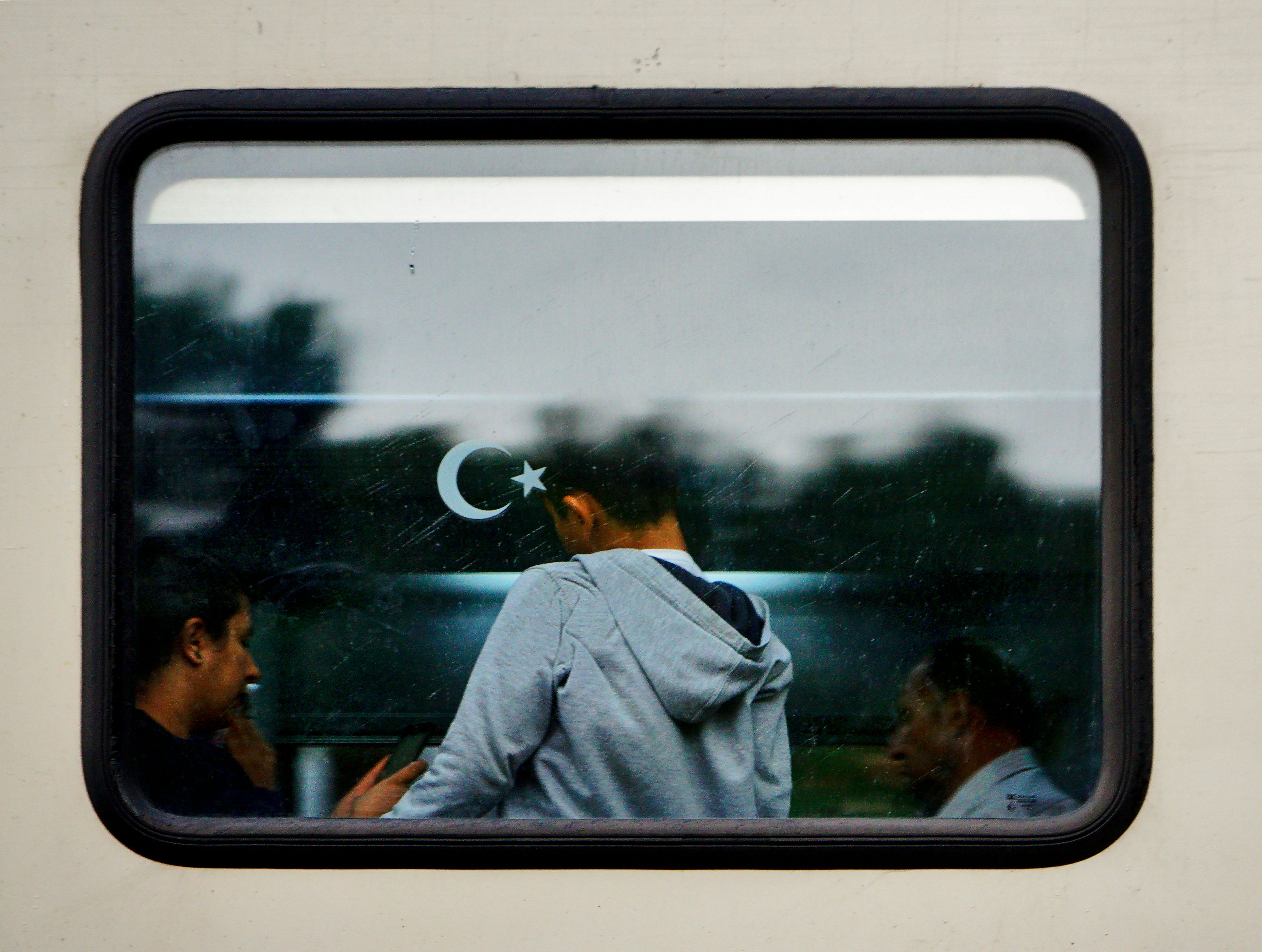 People on a Train Seen Through a Window · Free Stock Photo