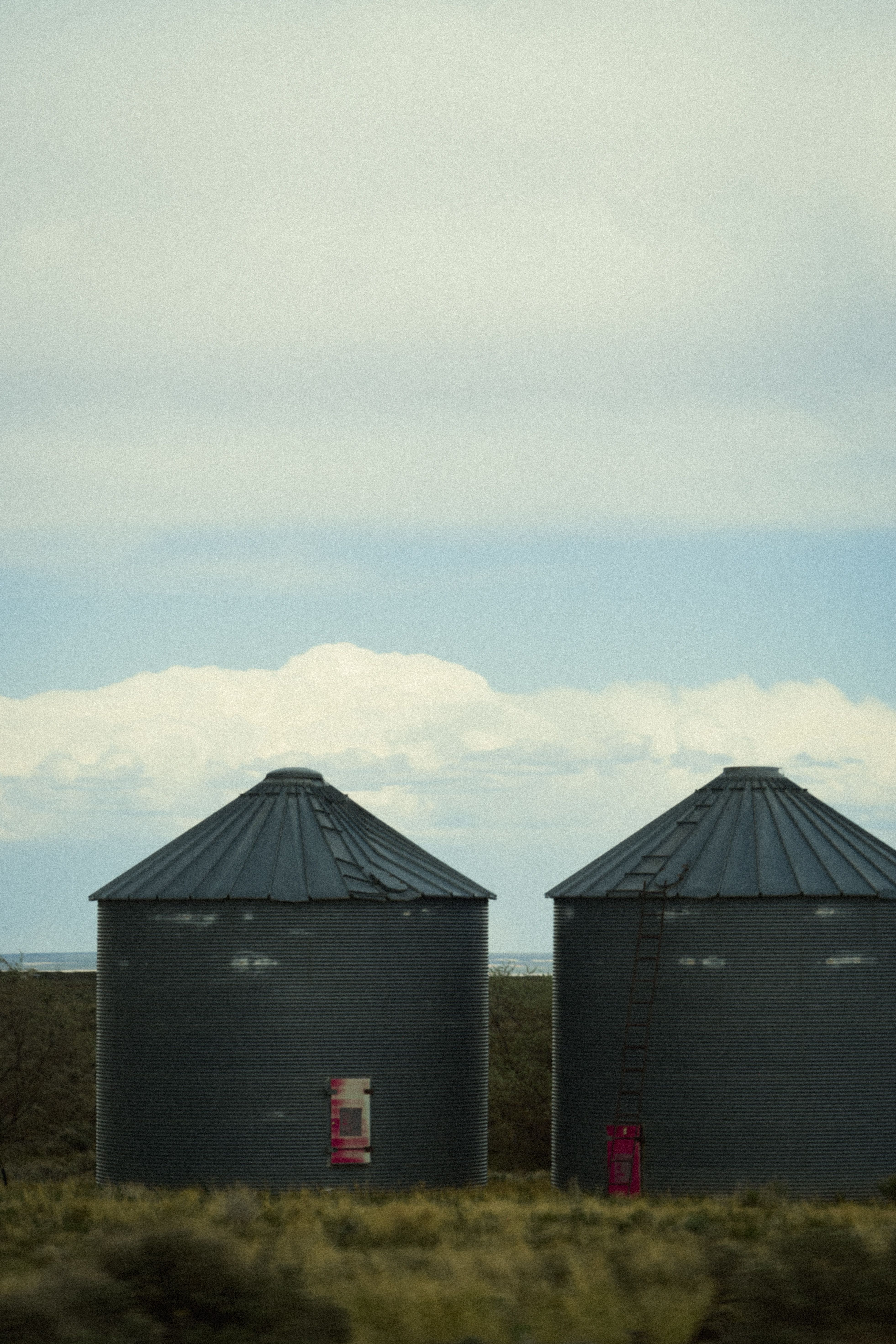 Rural Grain Silos in Open Landscape · Free Stock Photo