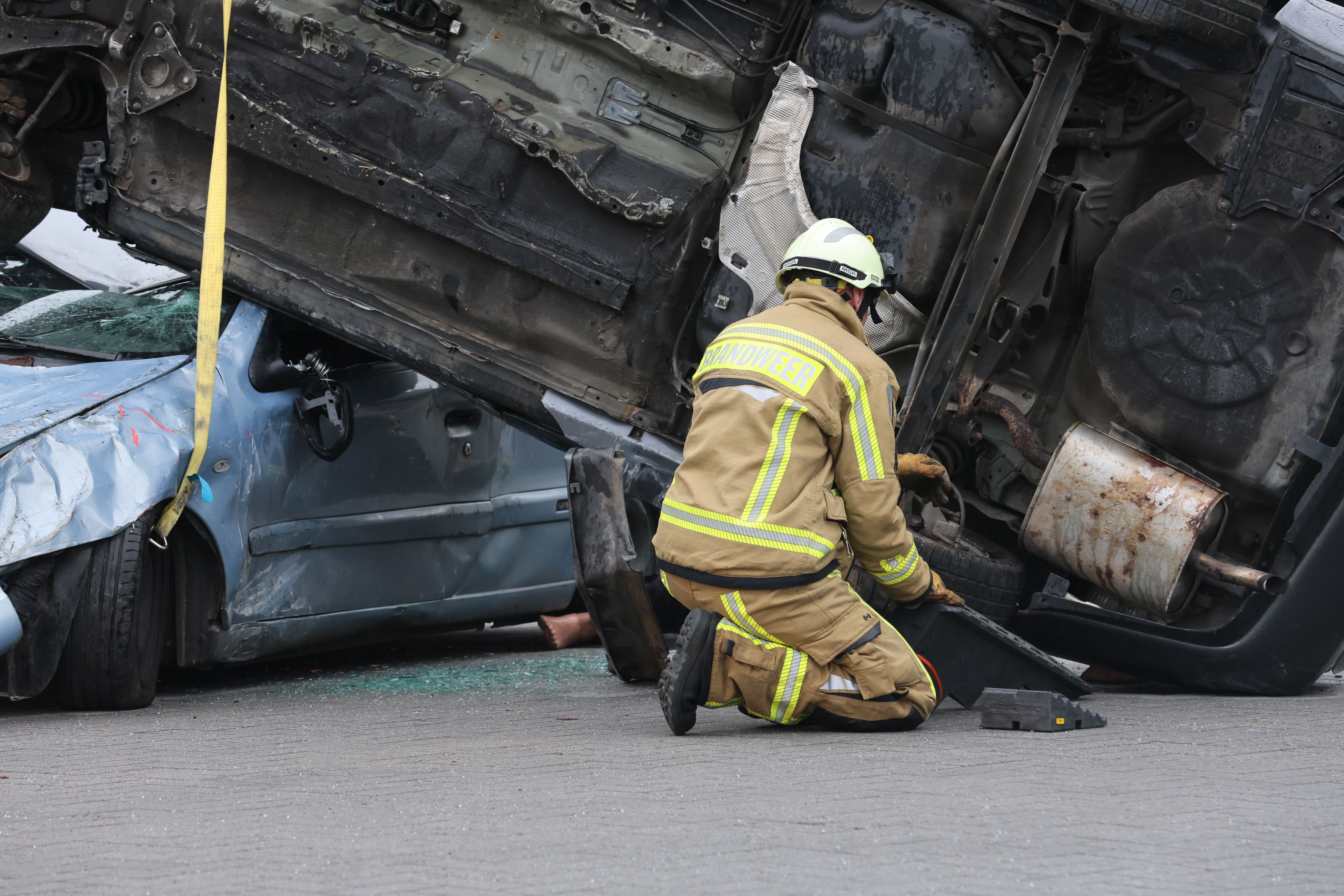 Firefighter Rescuing from Overturned Vehicle Accident Scene · Free ...