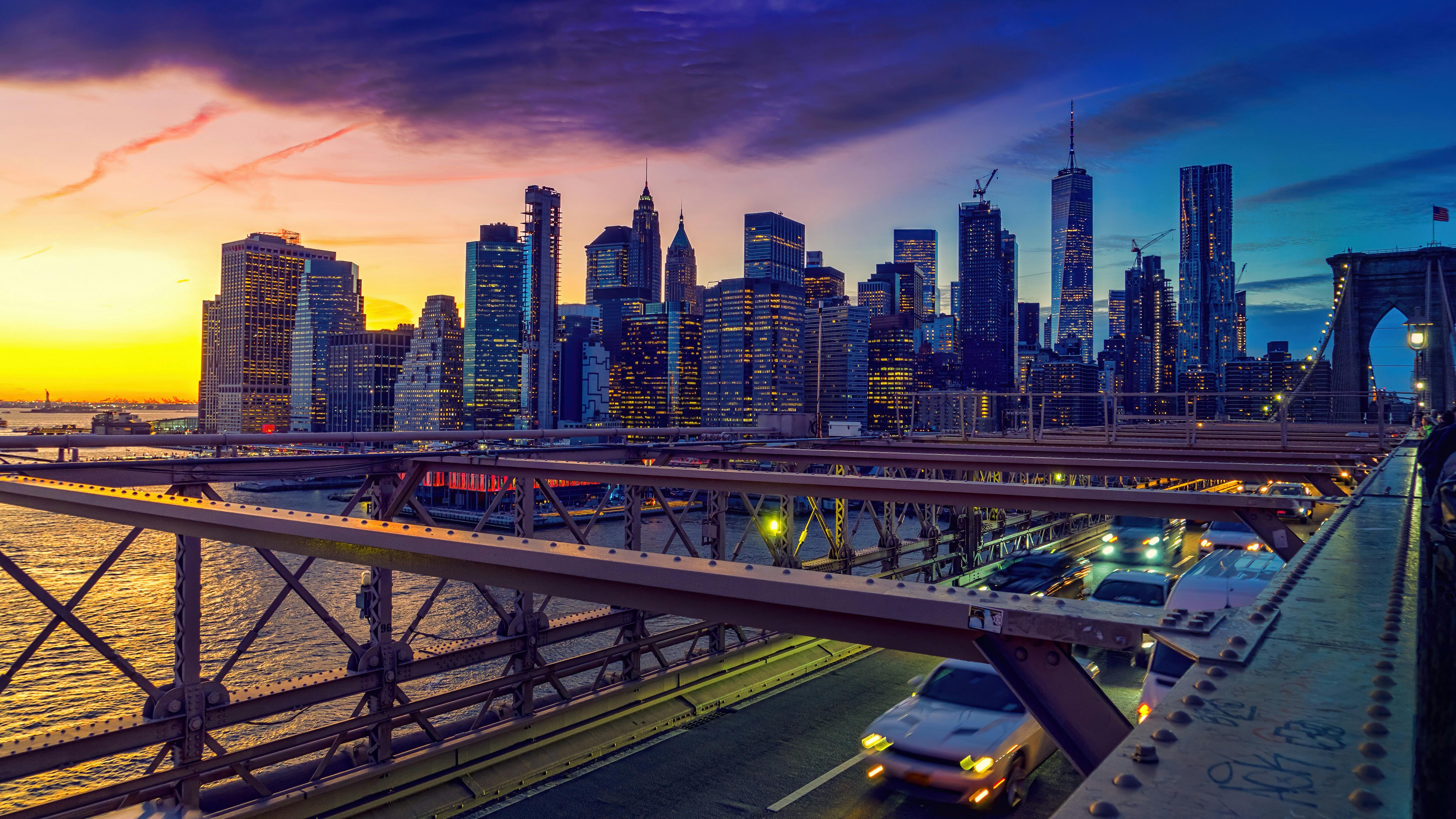 High Angle Shot Of Vehicles On A Bridge With The View Of The Cityscape ...