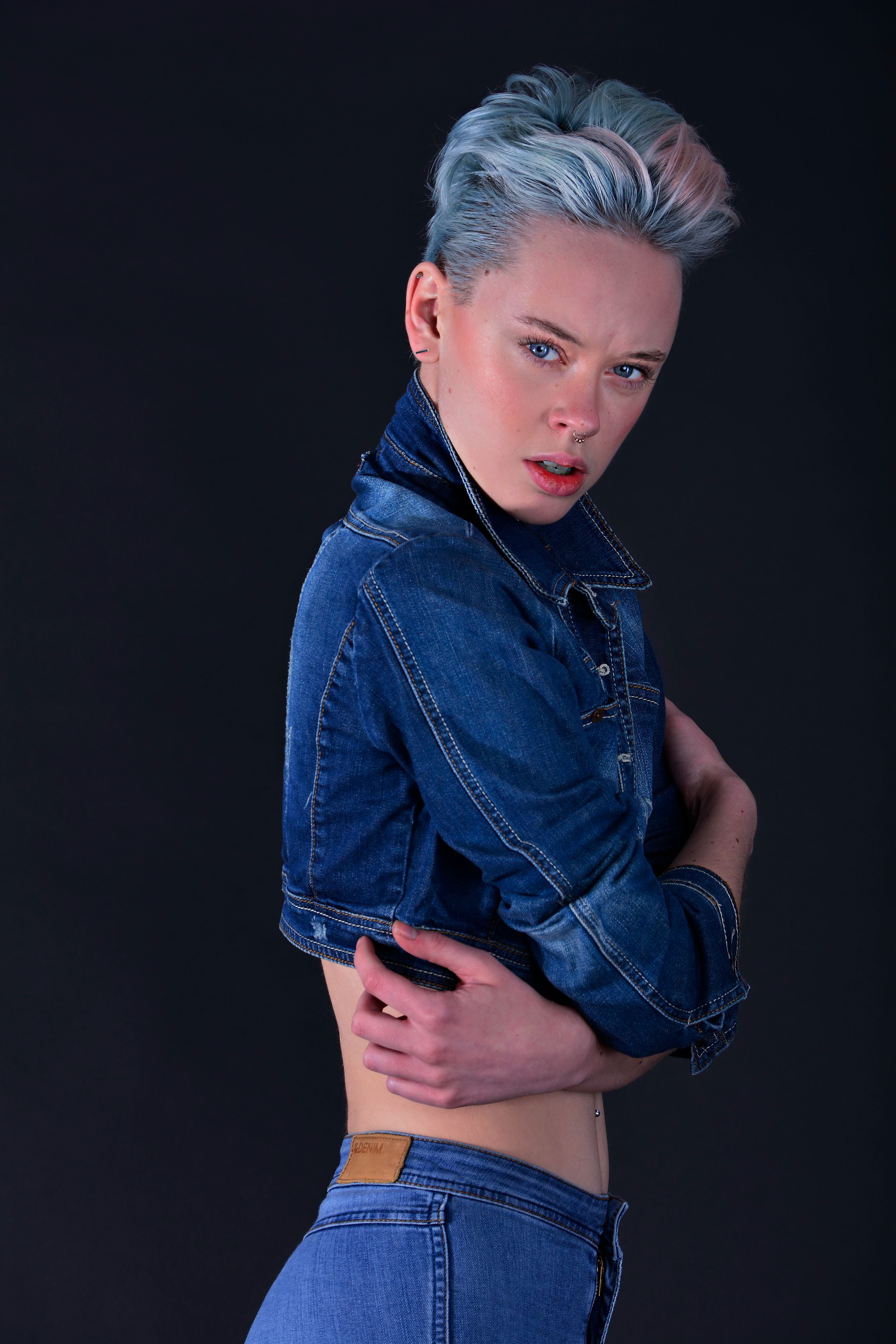 Stylish Model in Denim Jacket Posing Confidently · Free Stock Photo