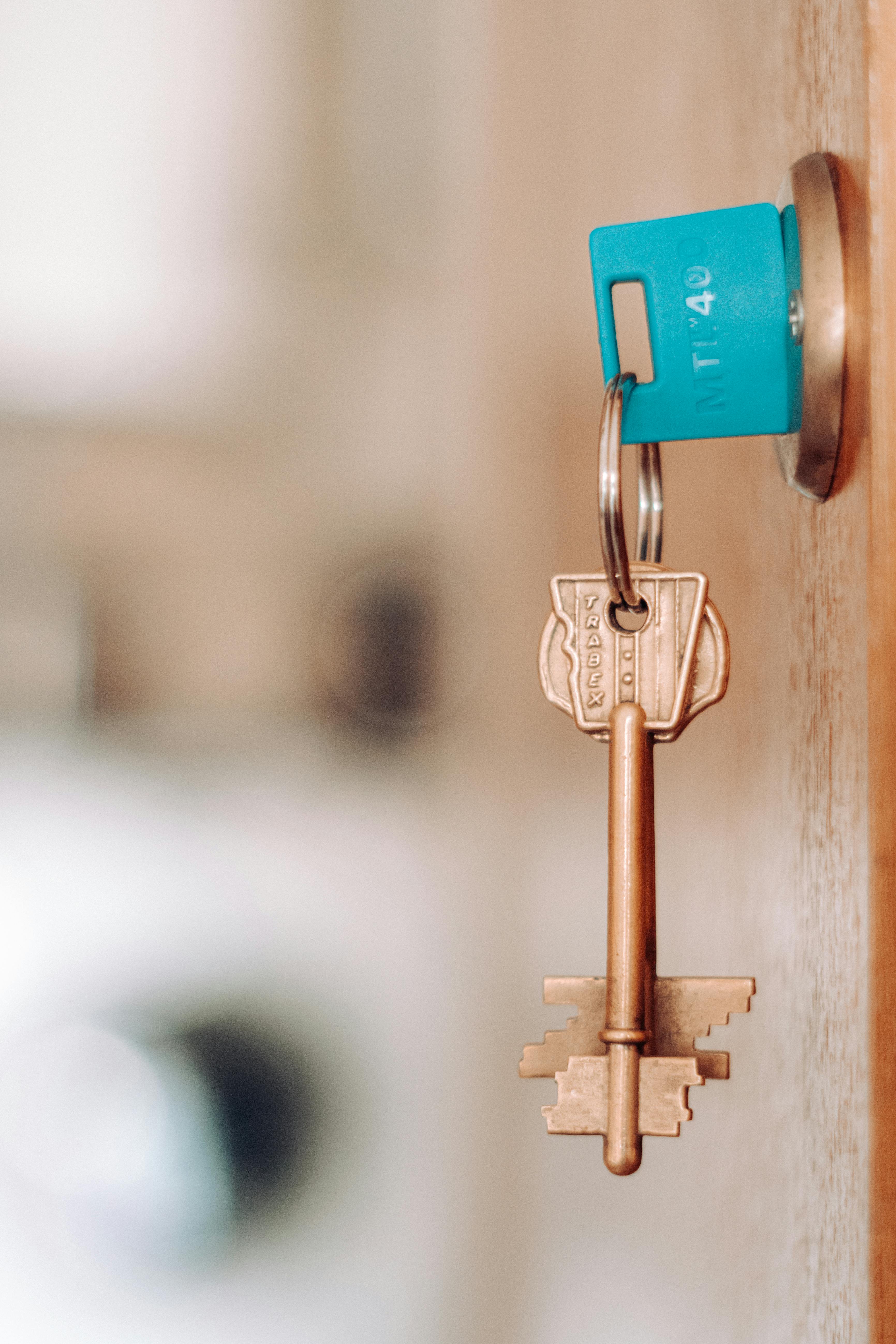 Close-up of Brass Key in Door Lock · Free Stock Photo