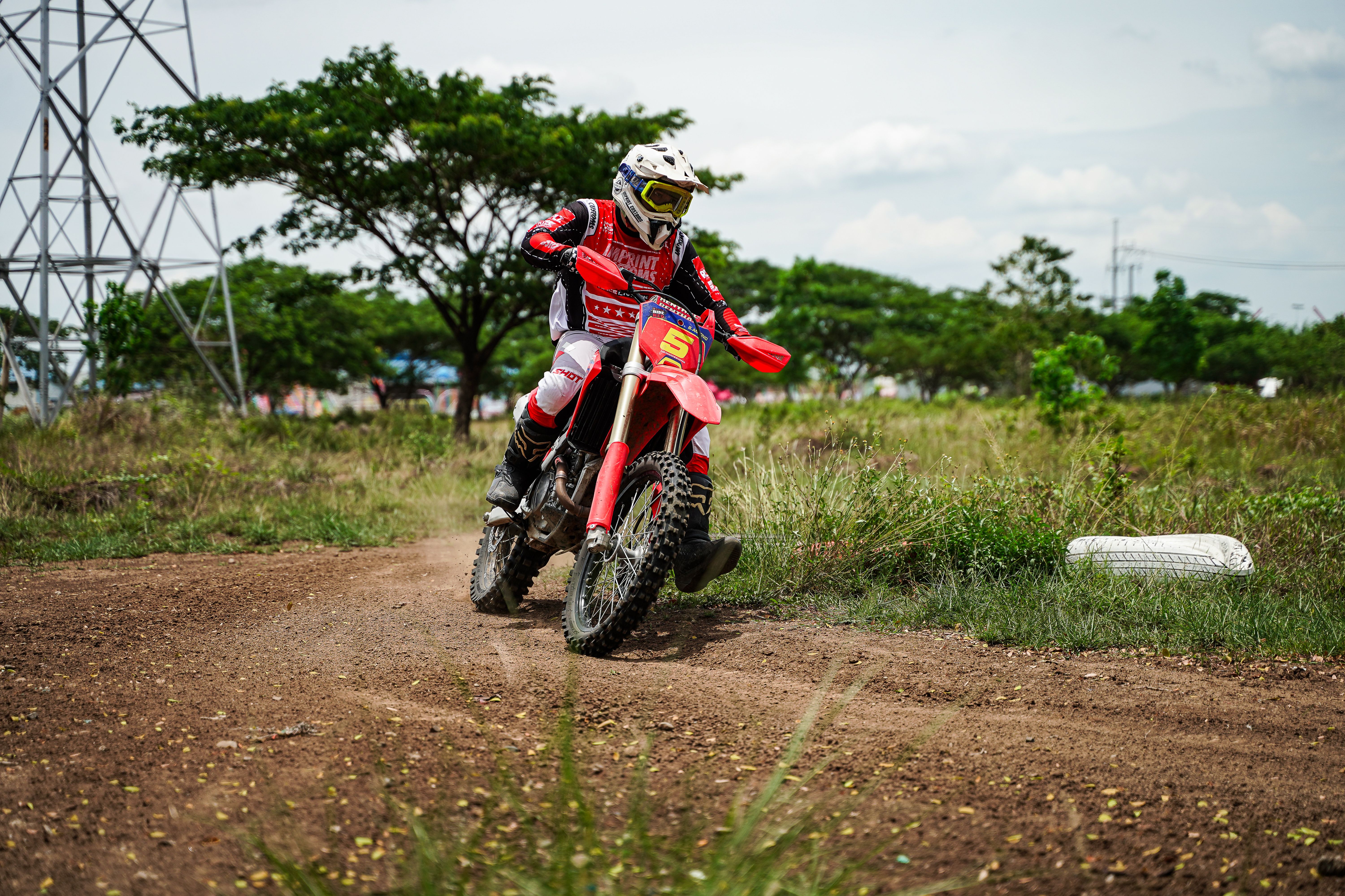 Motorcyclist Racing on Rural Dirt Track · Free Stock Photo