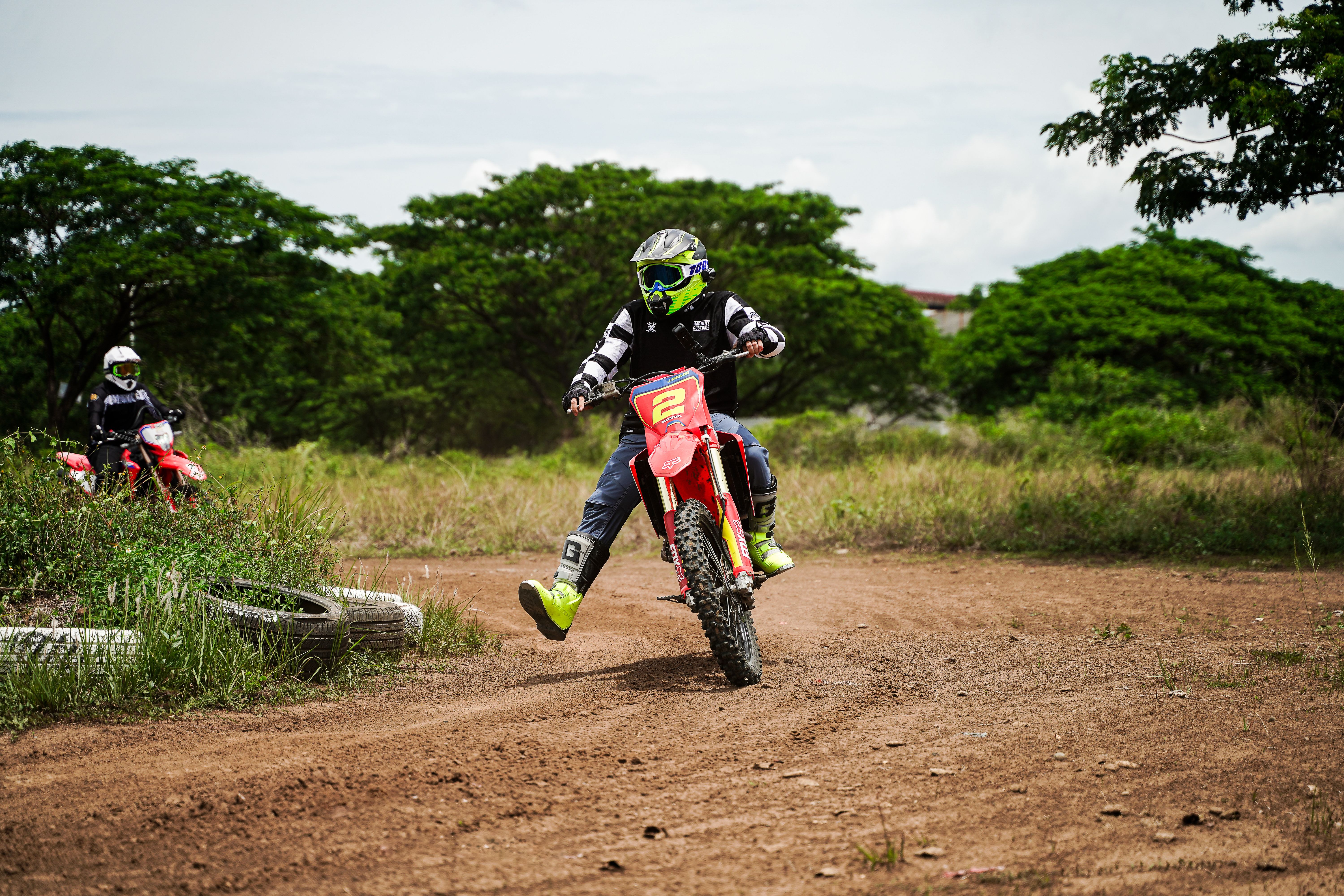Motocross Rider in Action on Dirt Track · Free Stock Photo