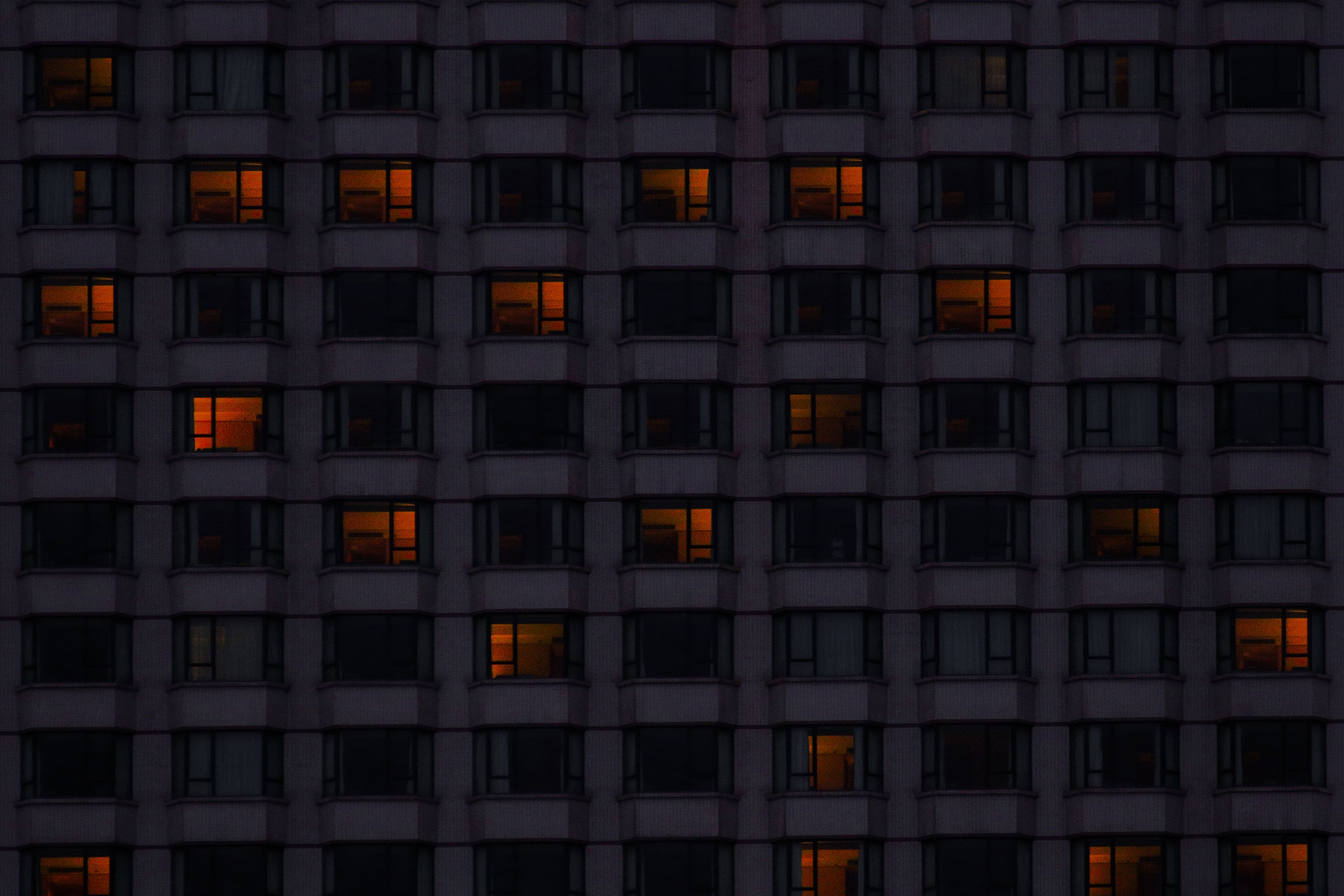 Close-Up of Illuminated Hotel Windows at Night · Free Stock Photo