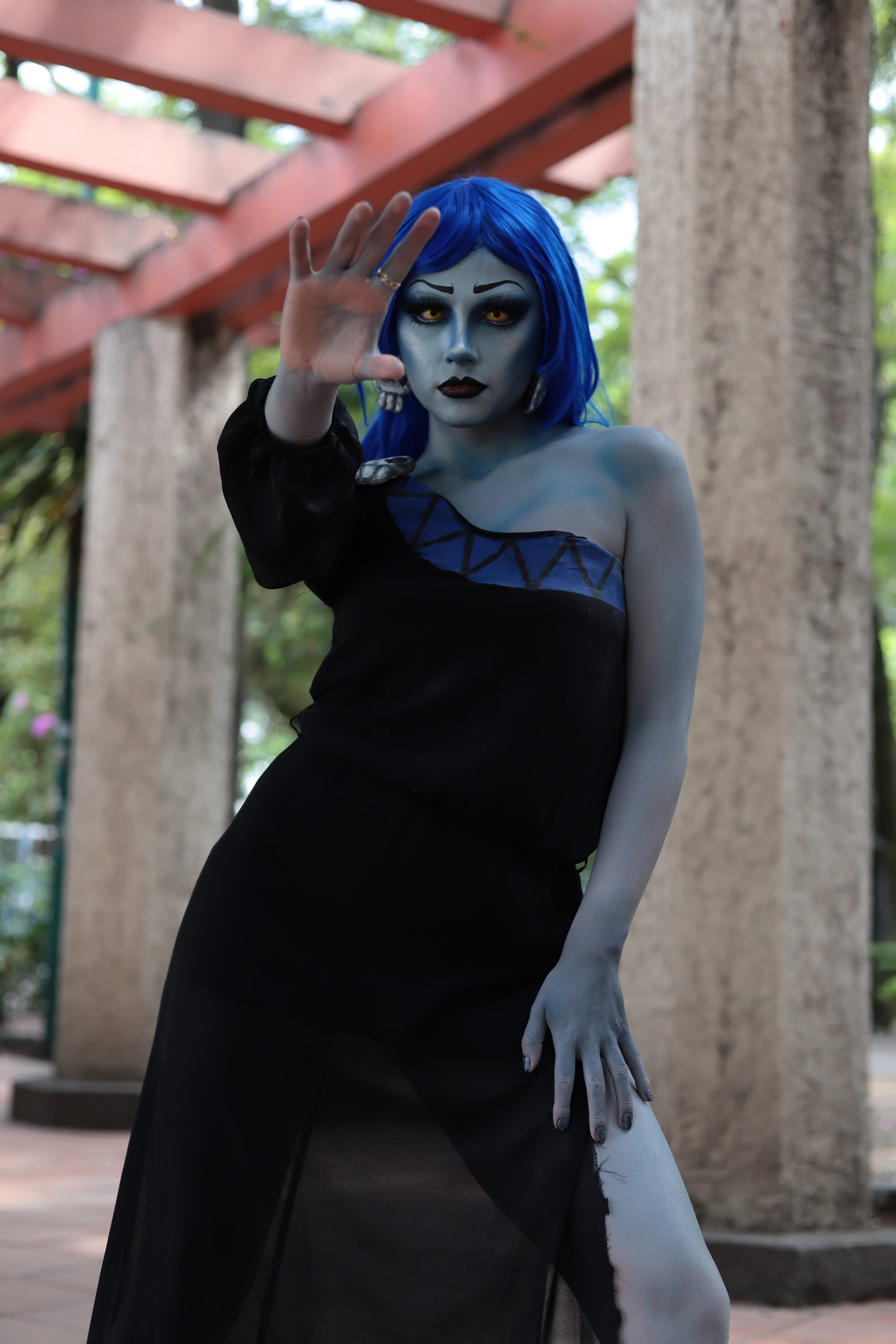 Blue Skinned Woman in Dark Dress with Dramatic Pose · Free Stock Photo