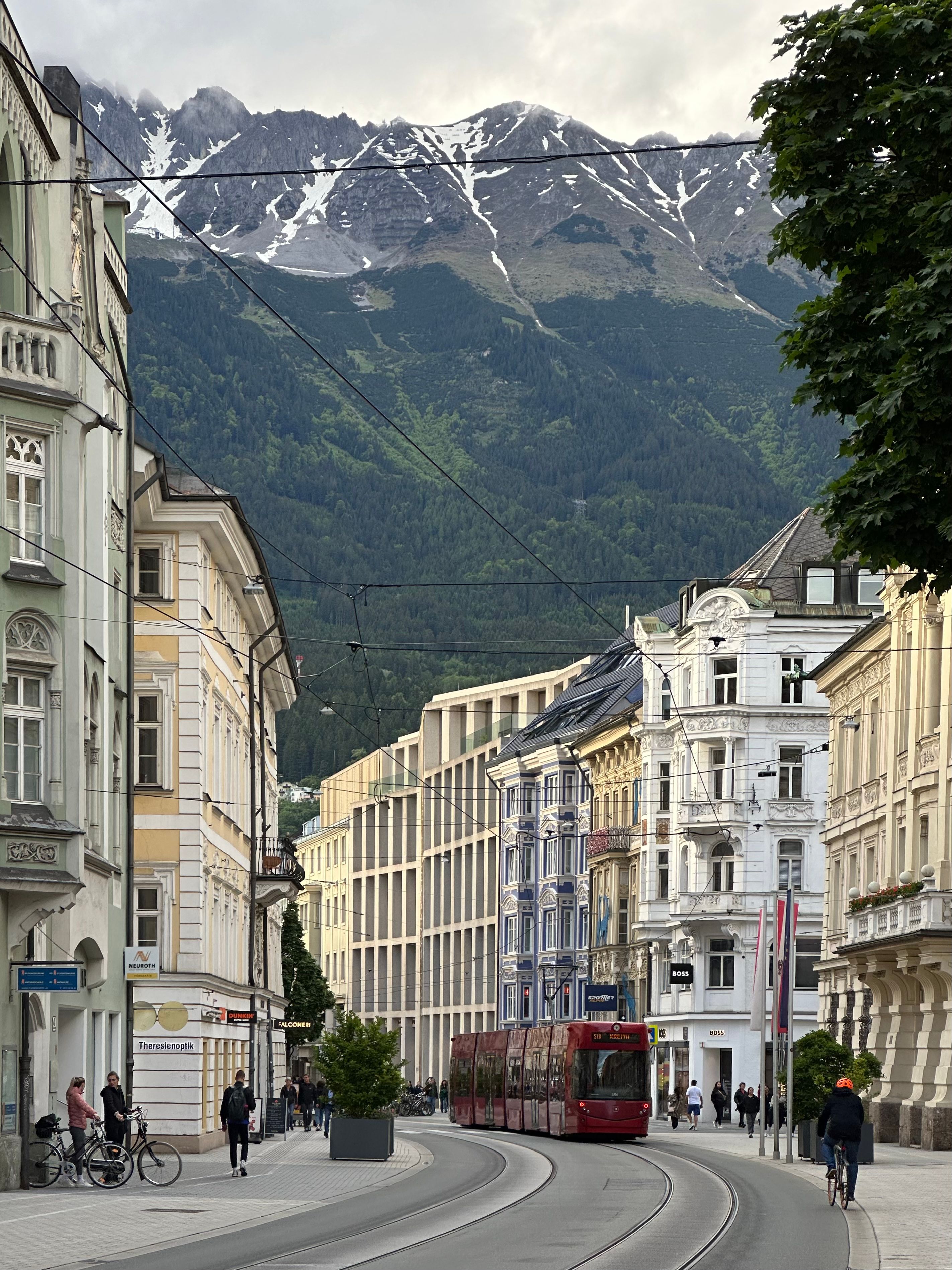 Innsbruck Cityscape with Tram and Mountain View · Free Stock Photo