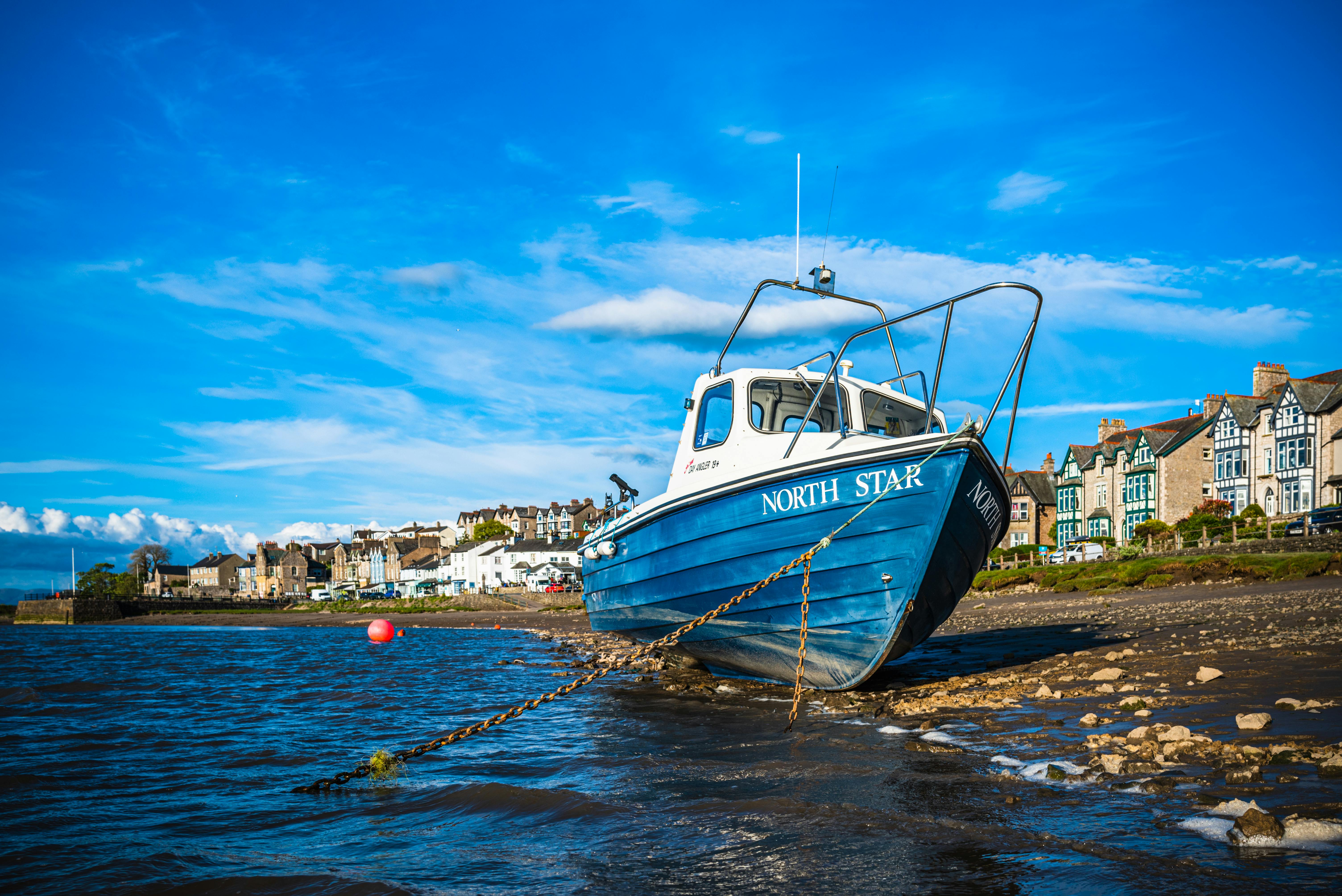 Blue fishing boat on Arnside shore, England · Free Stock Photo
