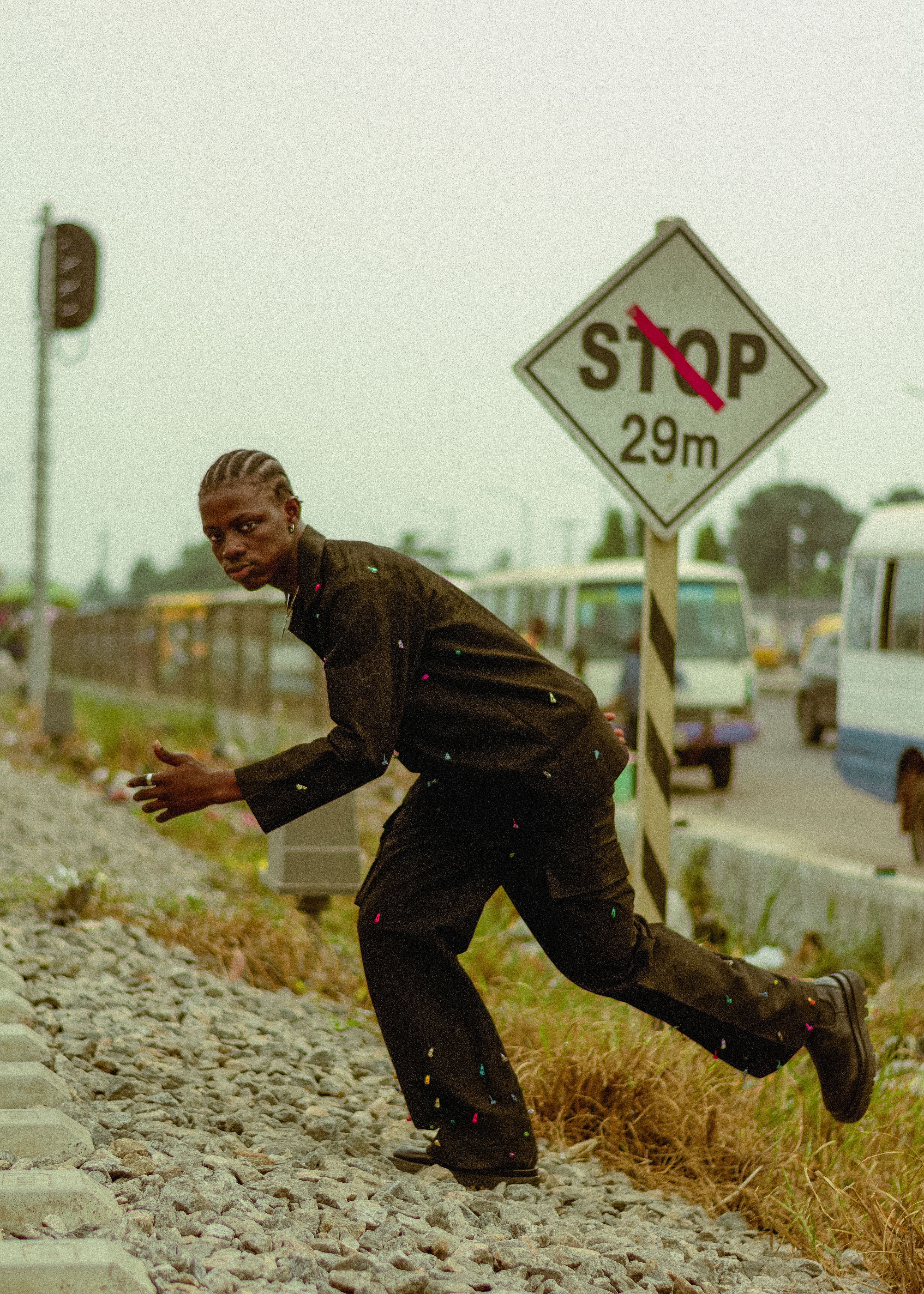 Man Running by Stop Sign on Urban Street · Free Stock Photo