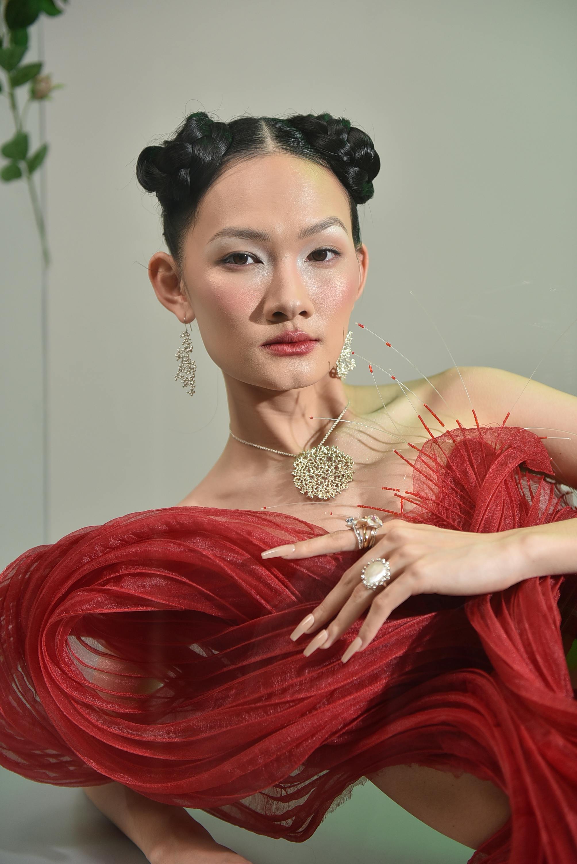 Elegant Portrait of Woman in Unique Red Dress · Free Stock Photo