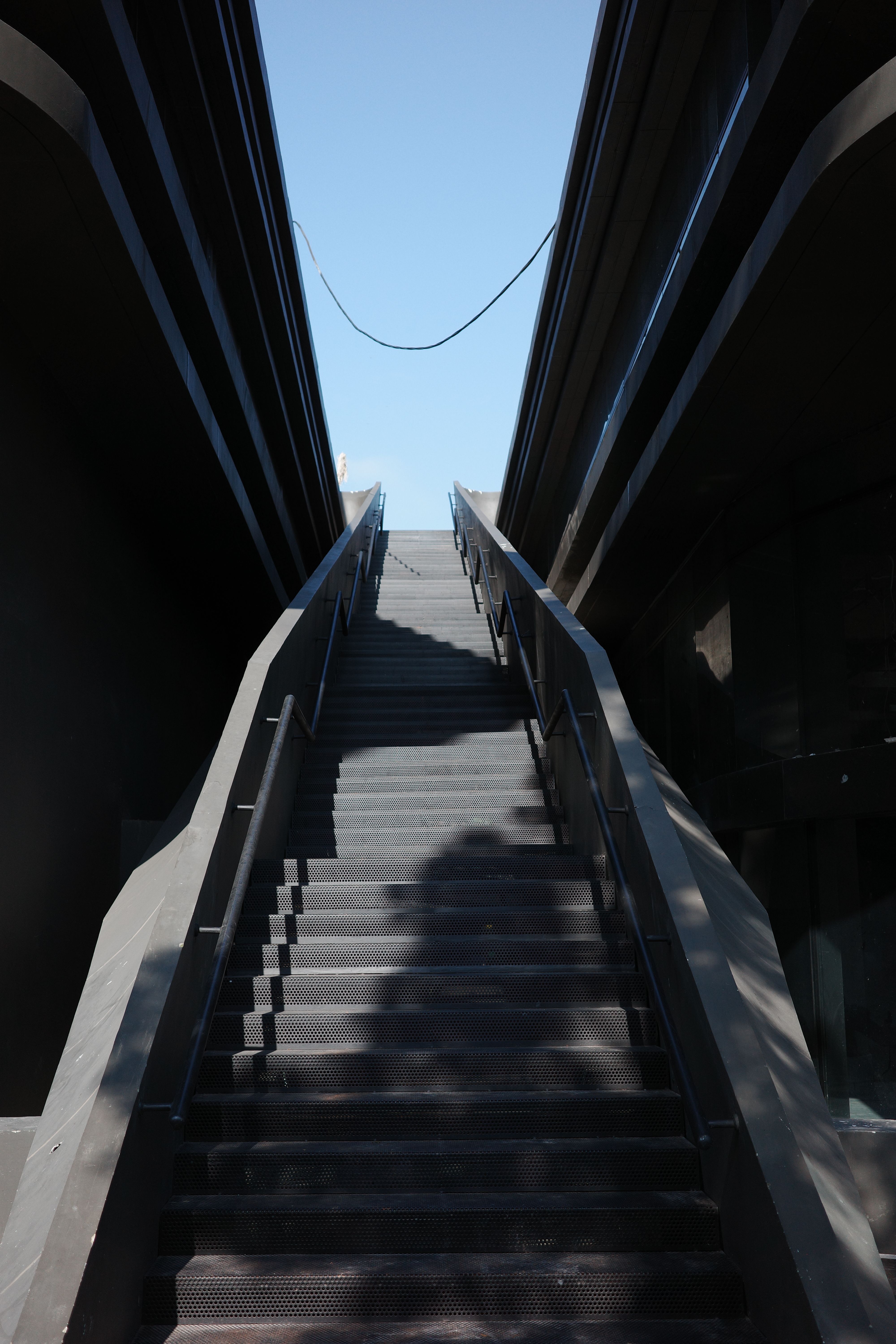 Modern Architectural Staircase with Shadow Patterns · Free Stock Photo