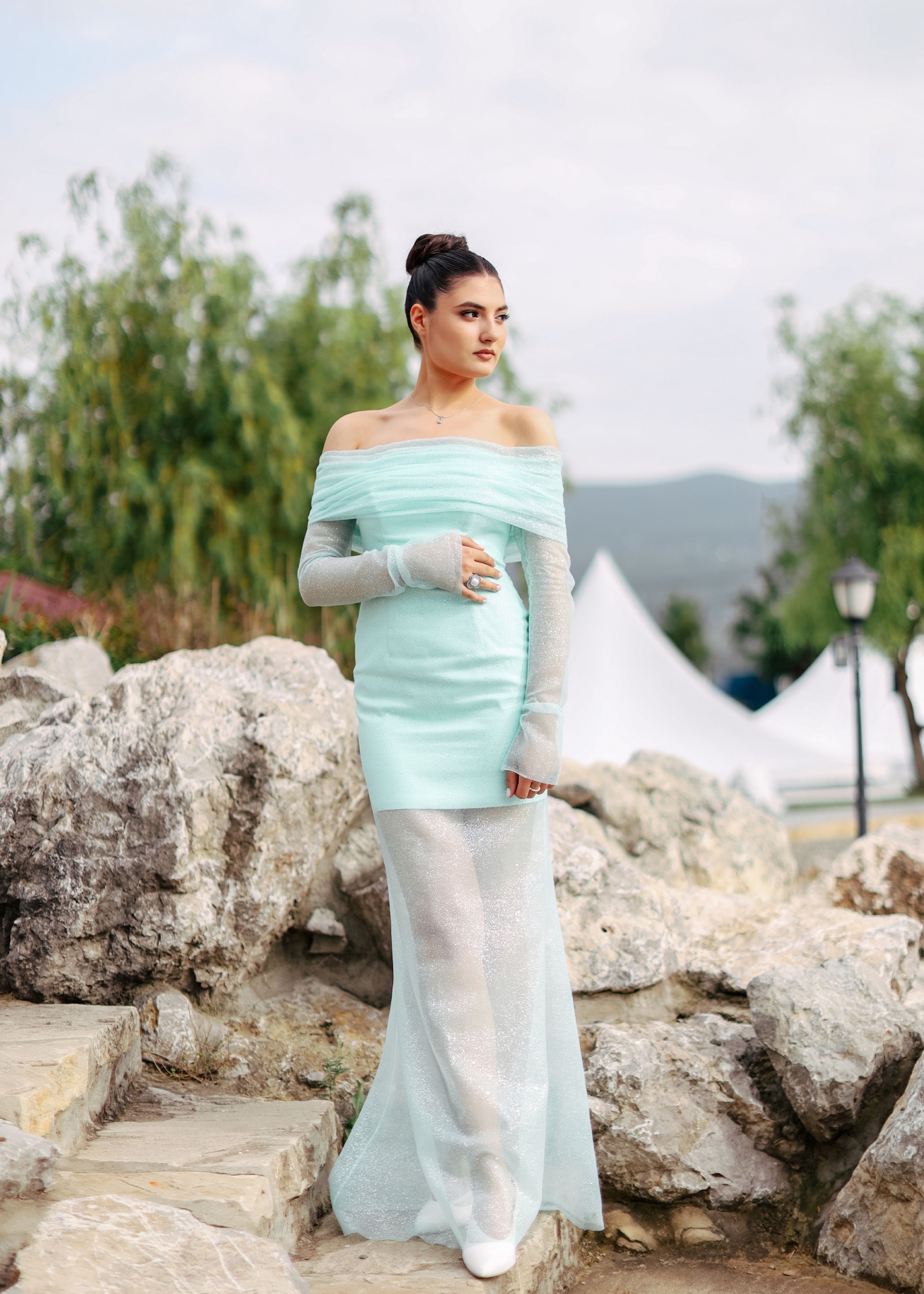 Elegant Woman in Pale Blue Off-Shoulder Dress Outdoors · Free Stock Photo