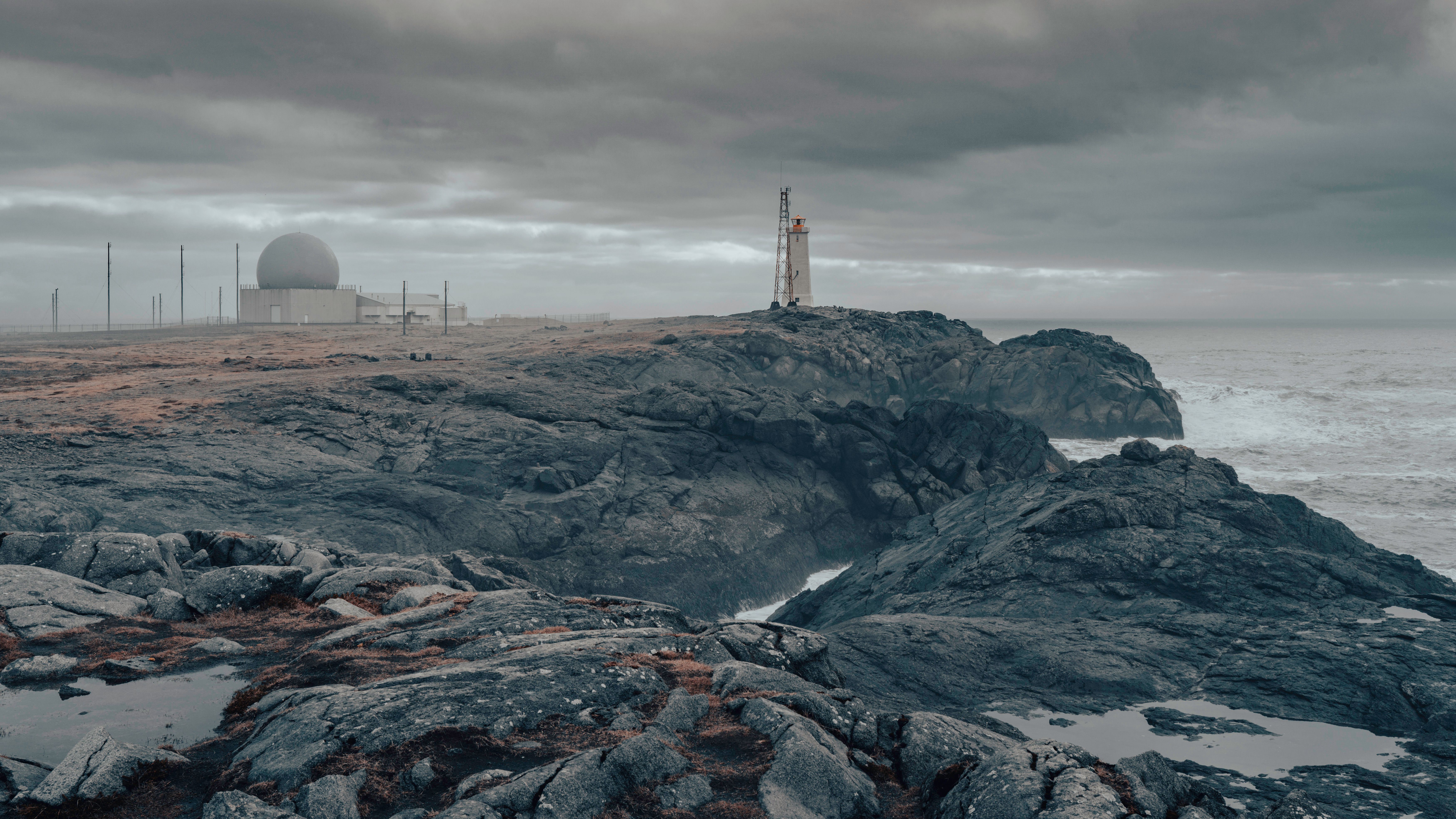 Dramatic Icelandic Coastline with Lighthouse · Free Stock Photo