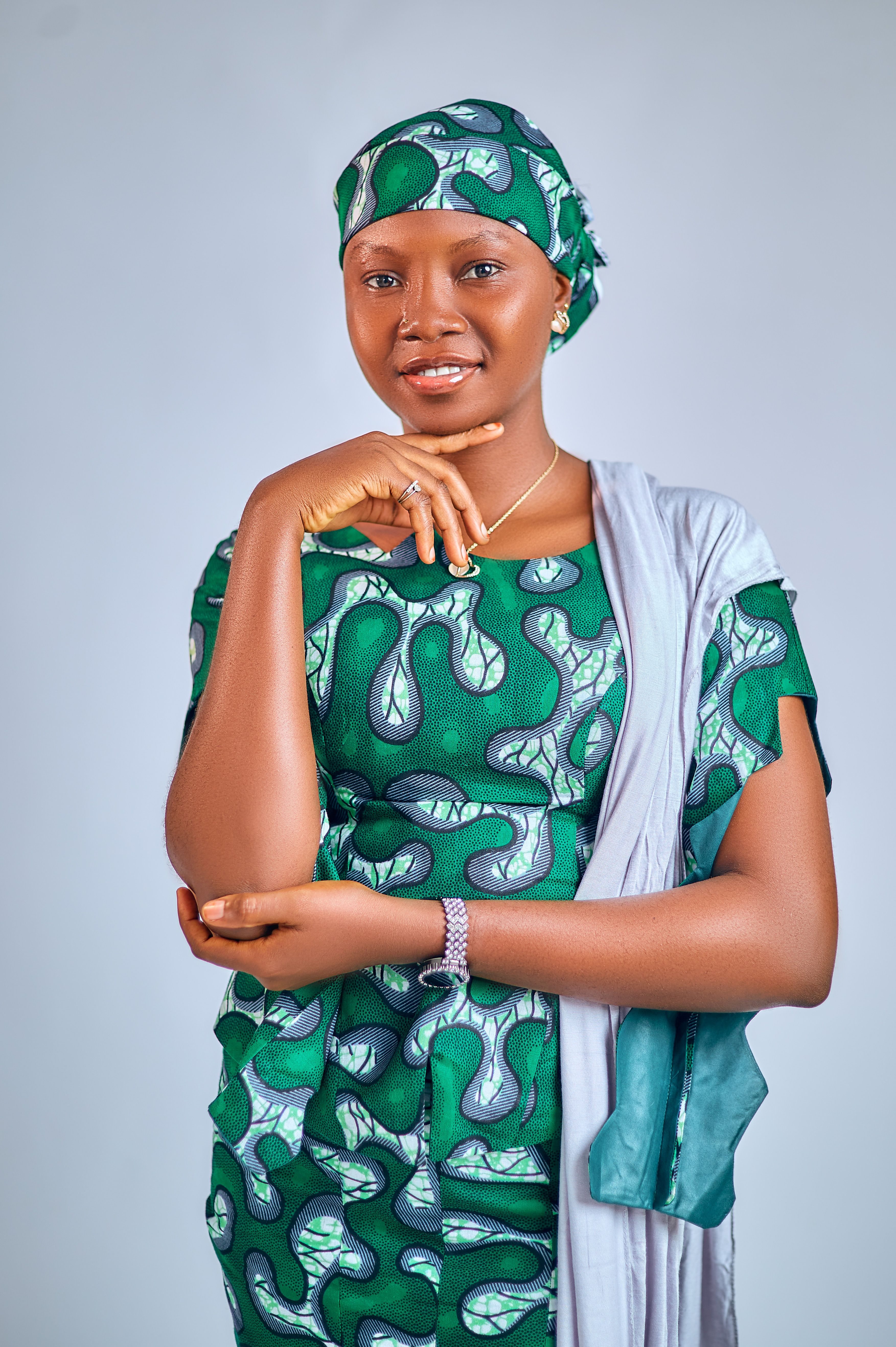Portrait of a Woman in Green Traditional Attire · Free Stock Photo