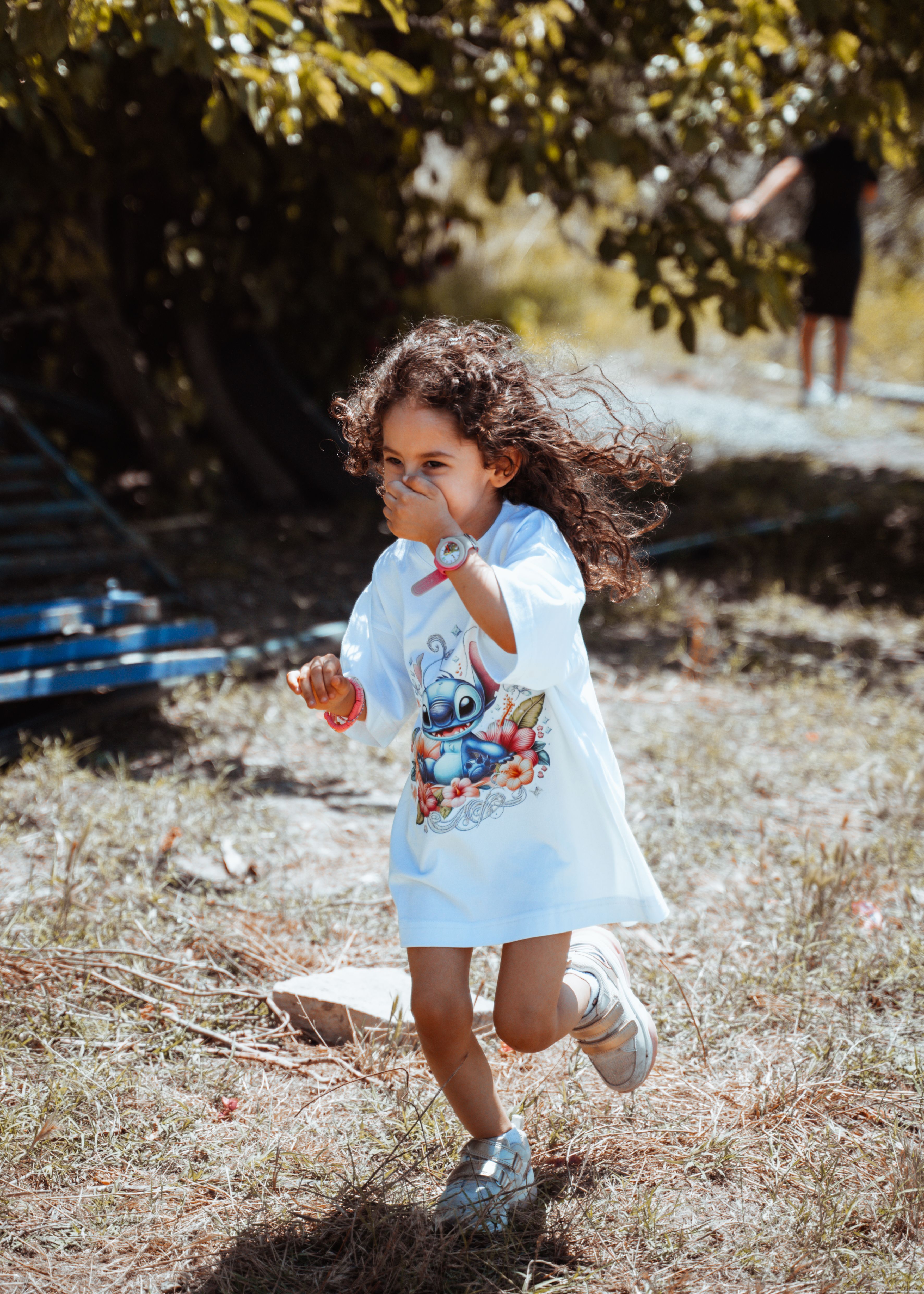 Young Girl Running Playfully Outdoors in Park · Free Stock Photo