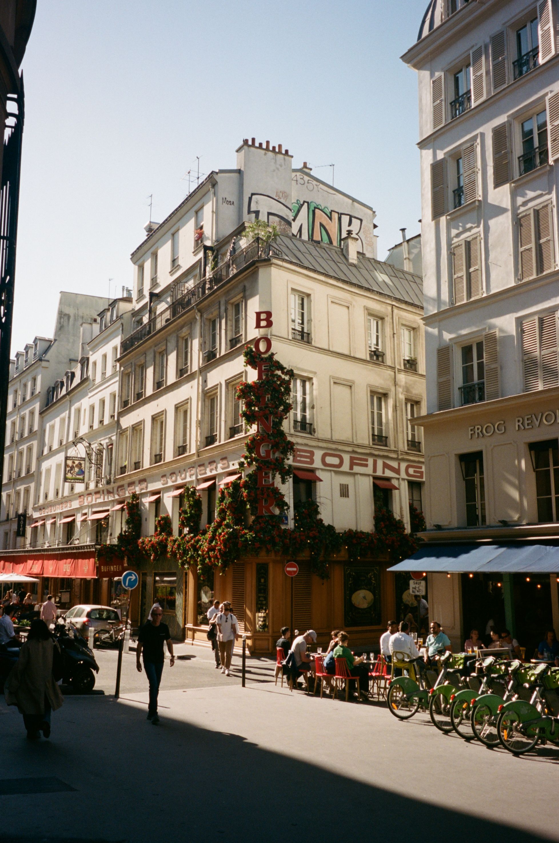 Charming Parisian Street Scene with Cafes · Free Stock Photo