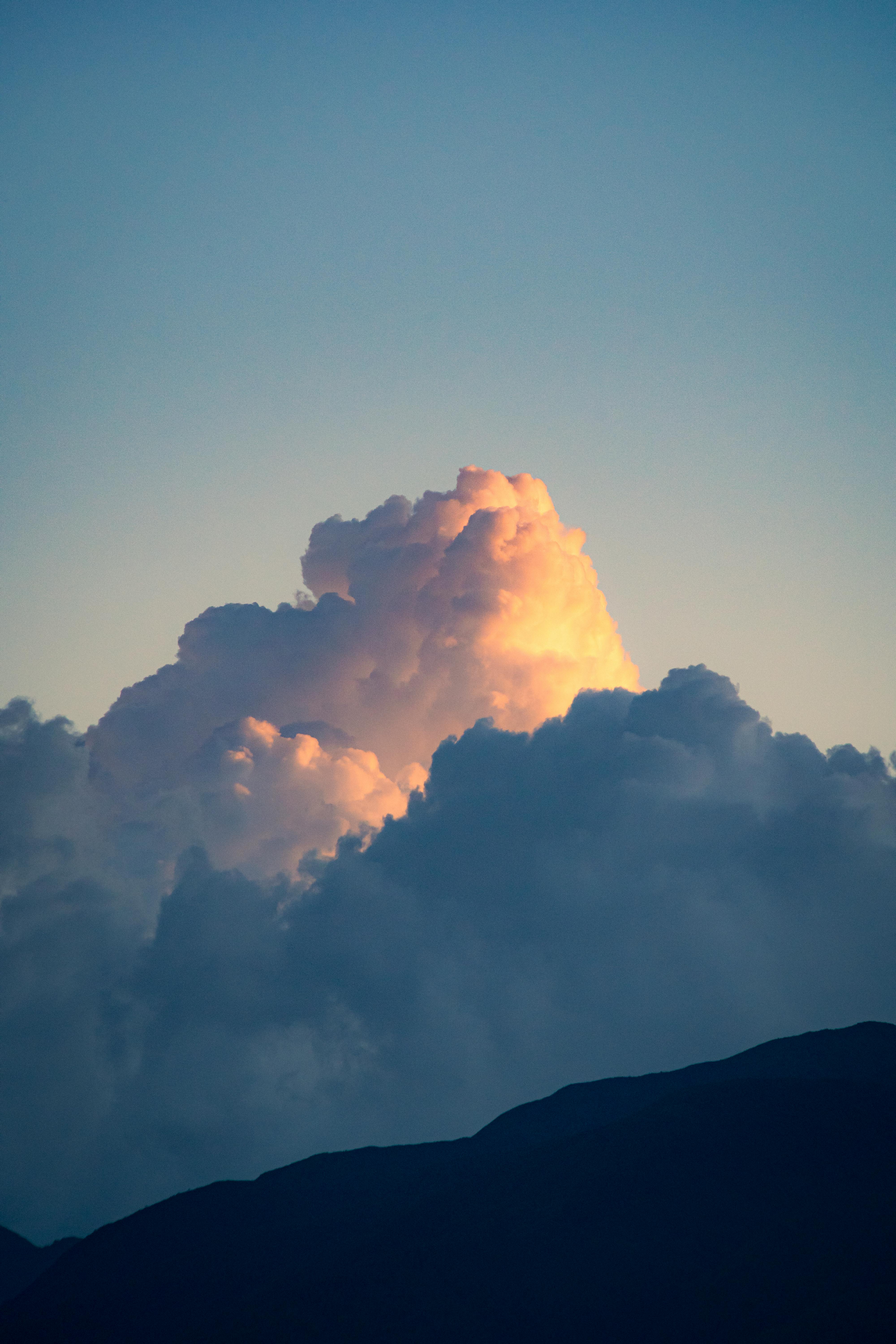 Dramatic Sunset Cloudscape Over Mountains · Free Stock Photo