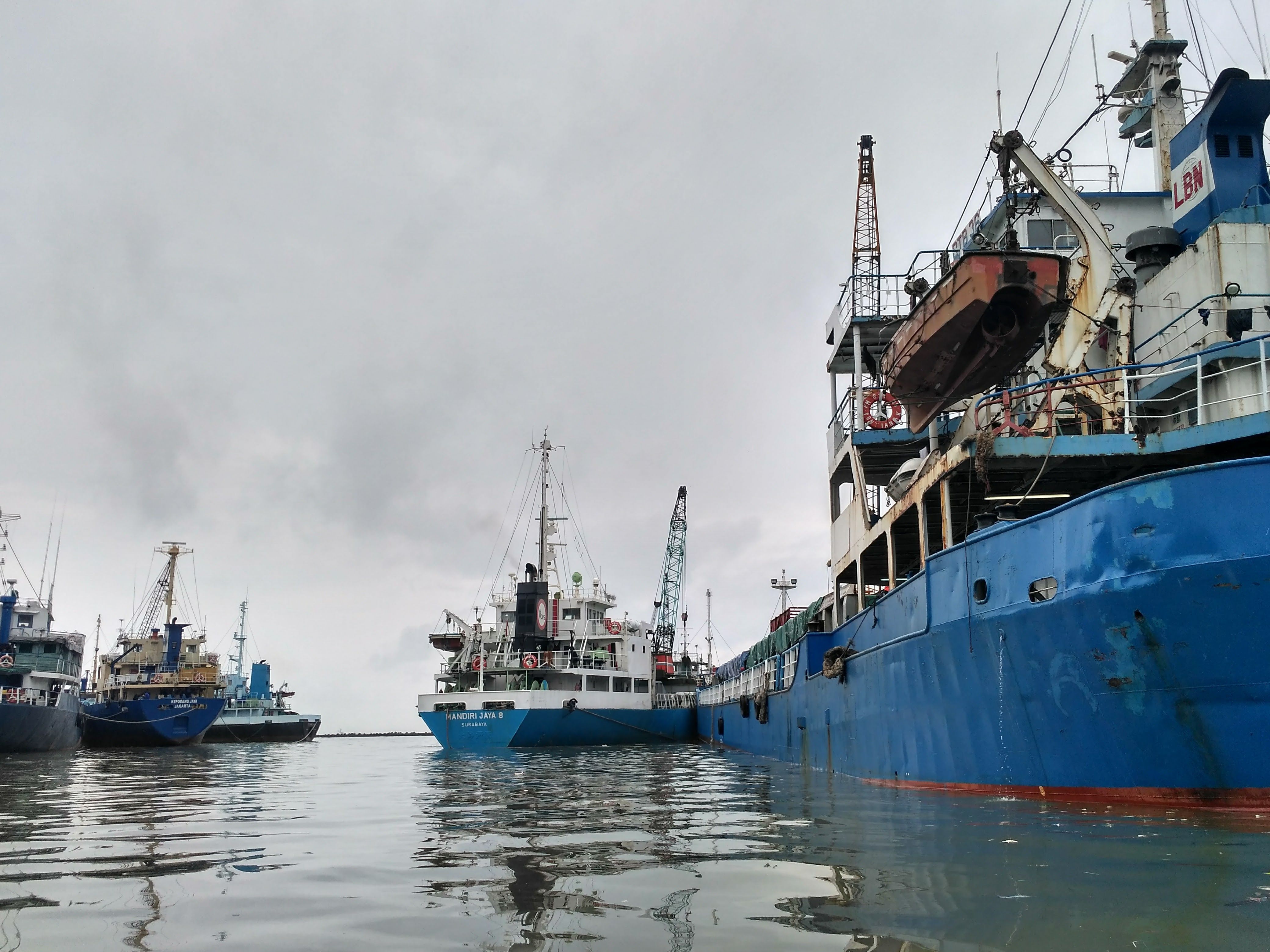 Majestic Blue Ships Docked in Jakarta Harbor · Free Stock Photo