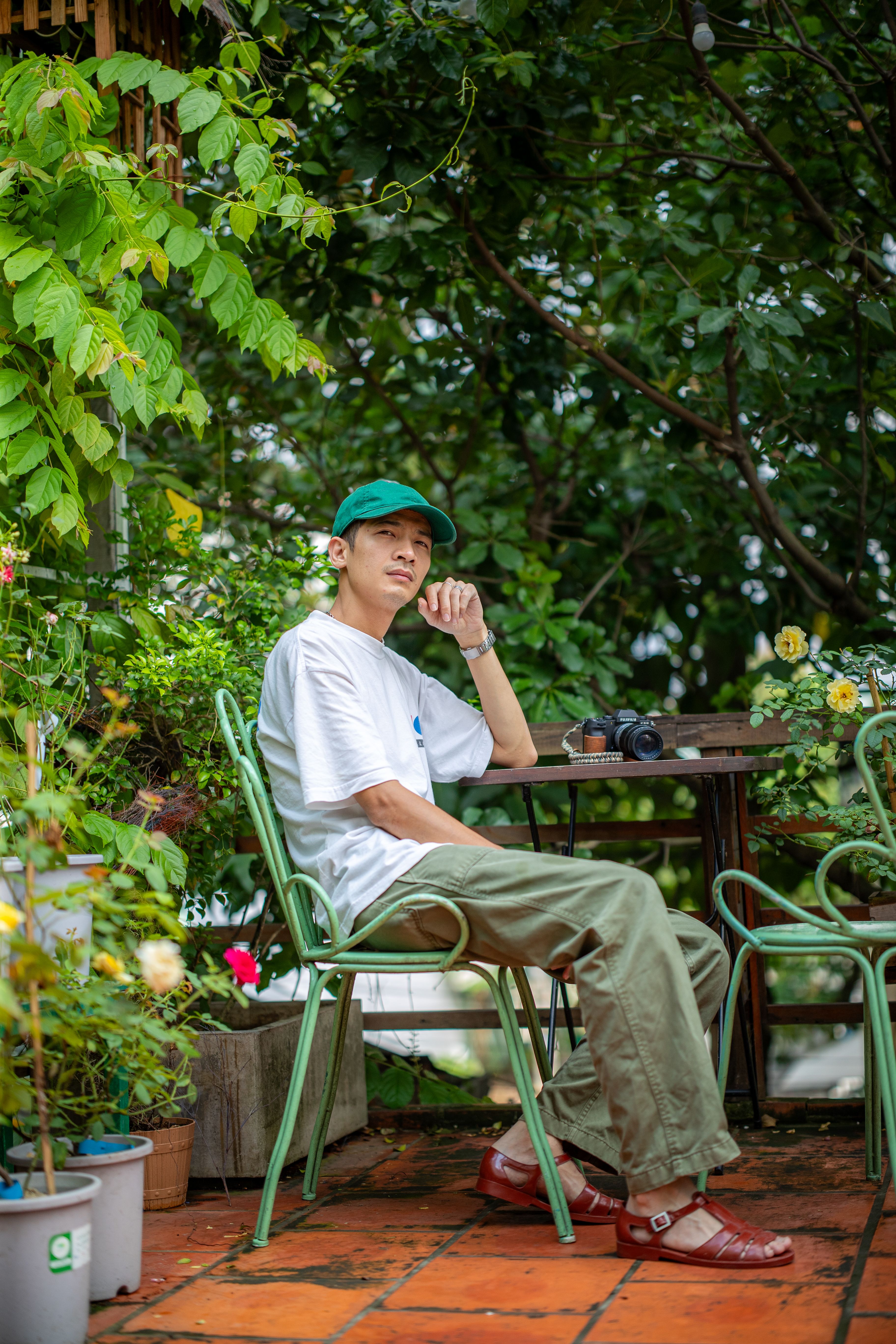 Man Relaxing in Lush Garden Setting · Free Stock Photo