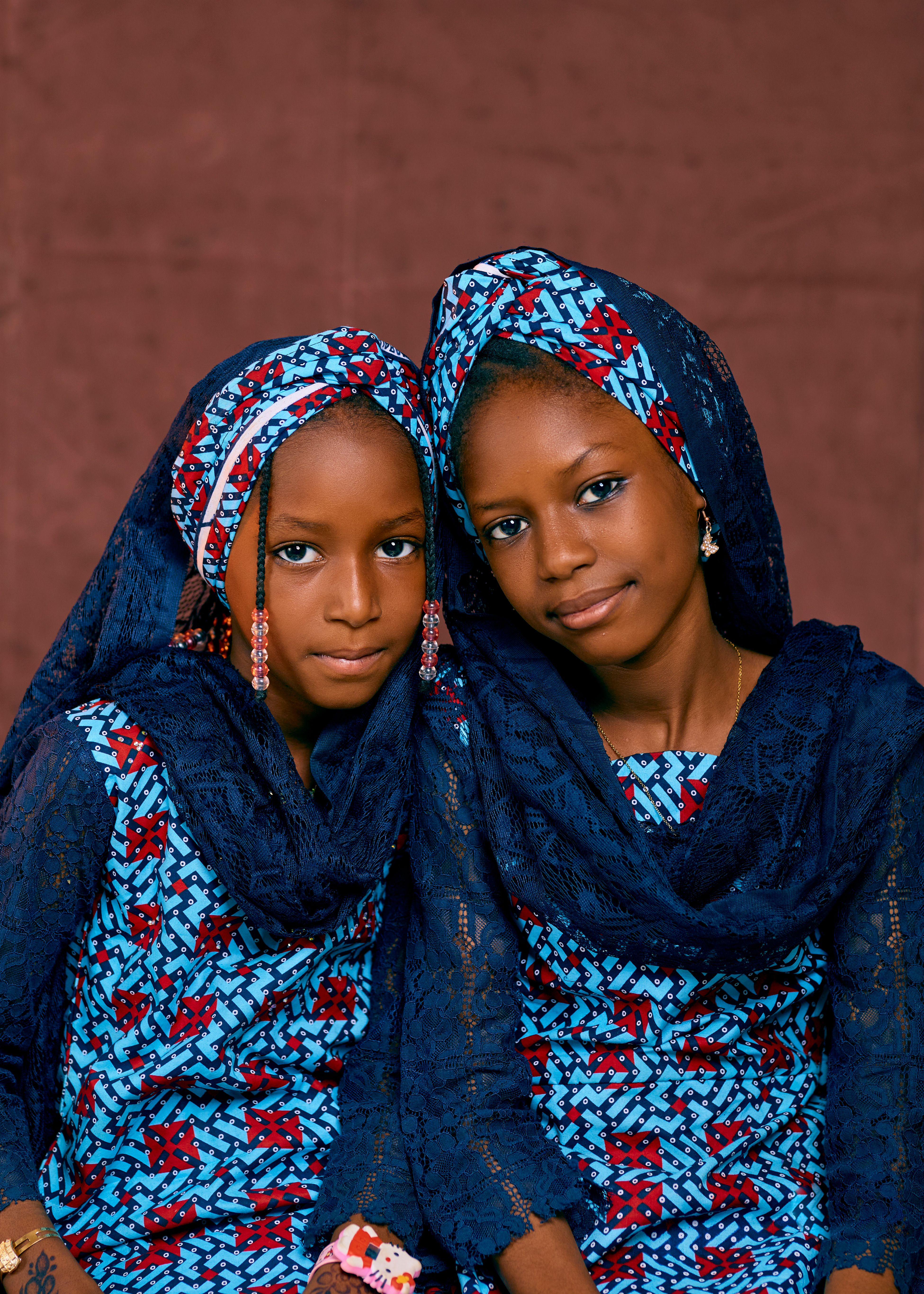 Portrait of Two Girls in Traditional Attire · Free Stock Photo