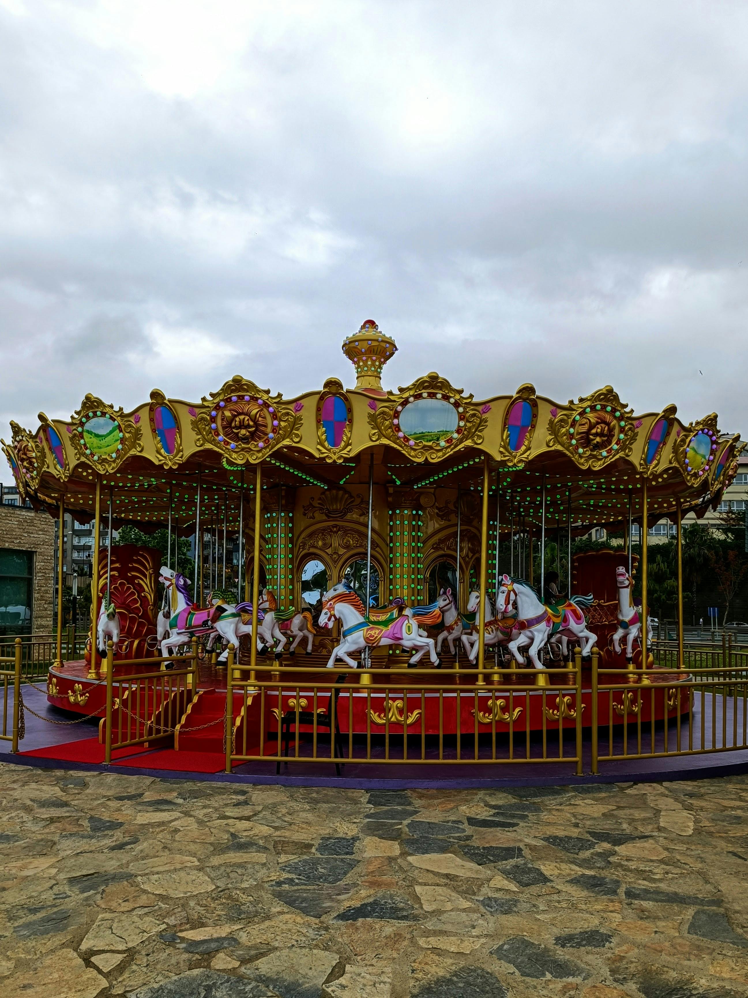 Colorful Carousel in a Park Setting · Free Stock Photo