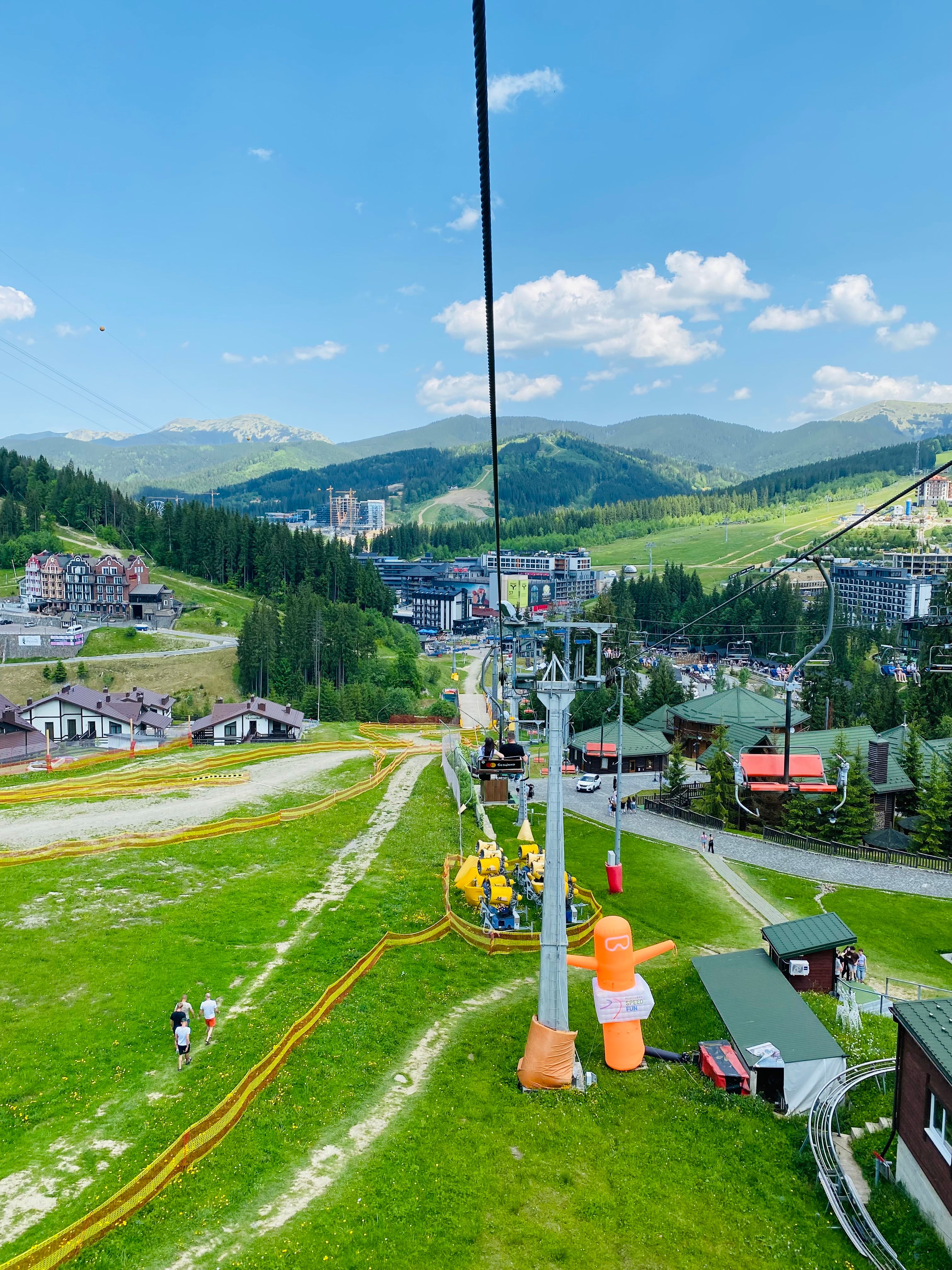 Scenic Cable Car View Over Green Hills · Free Stock Photo