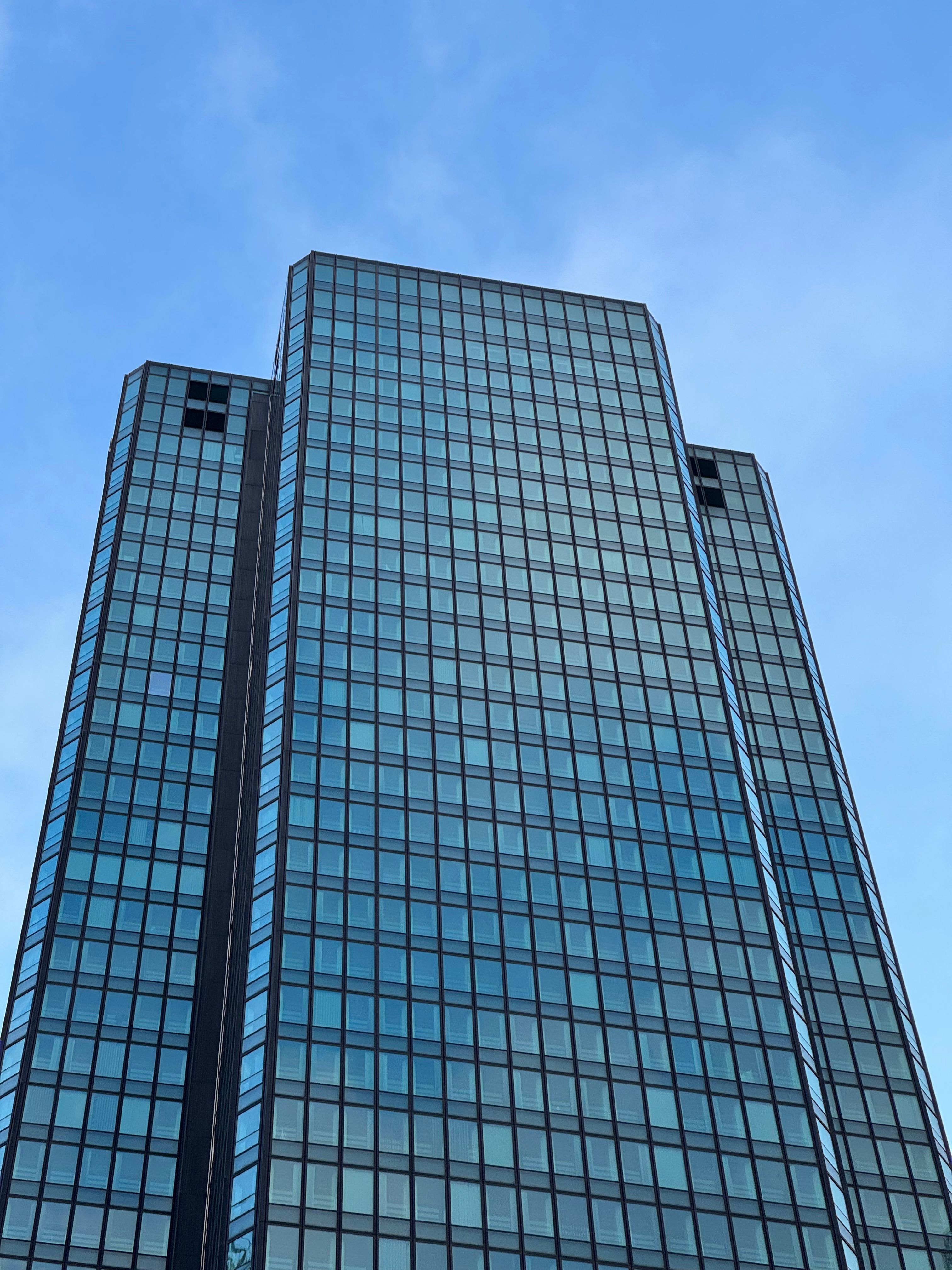 Modern Glass Skyscraper Against Blue Sky · Free Stock Photo