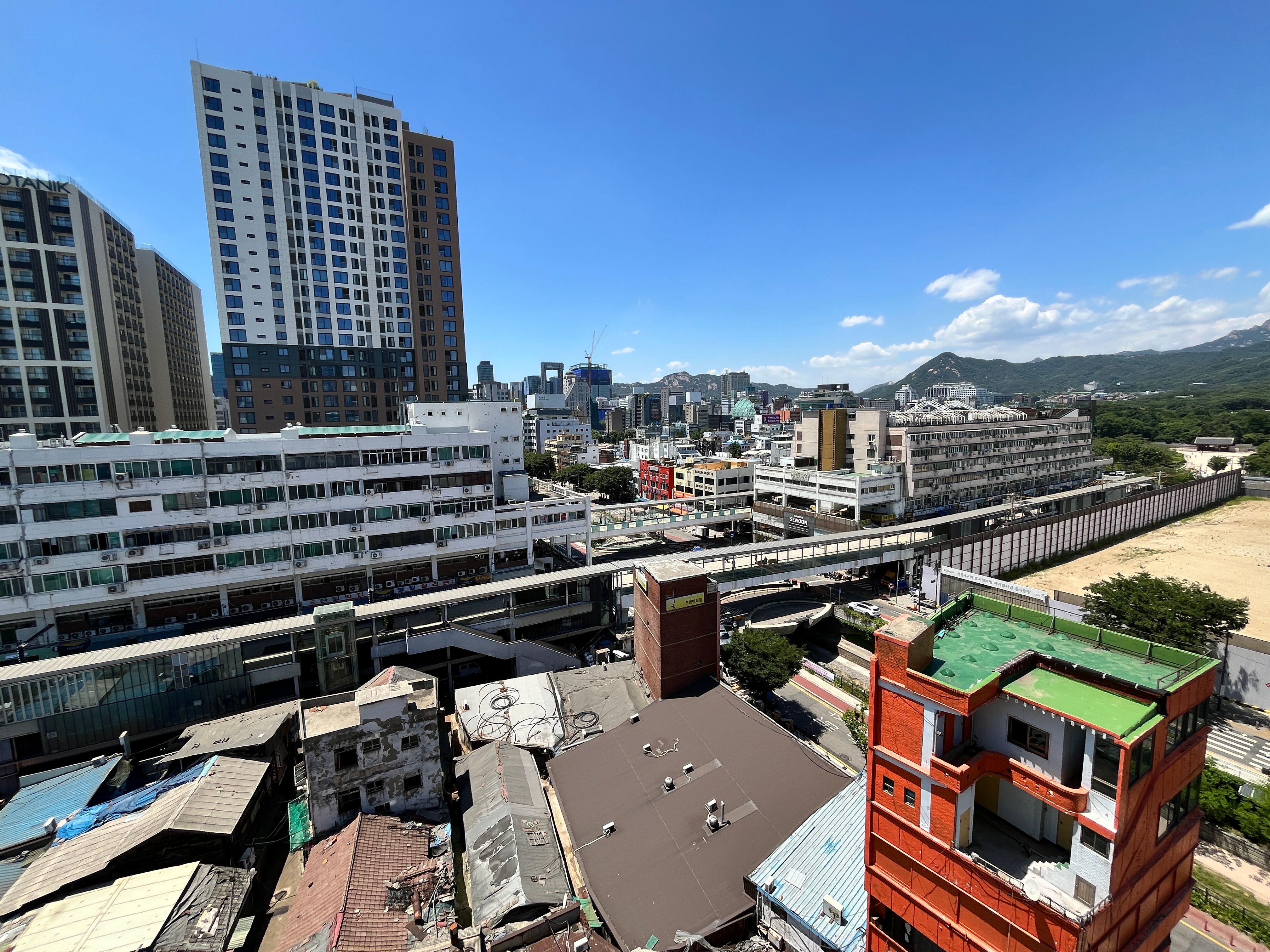 Aerial View of Urban Cityscape with Blue Sky · Free Stock Photo