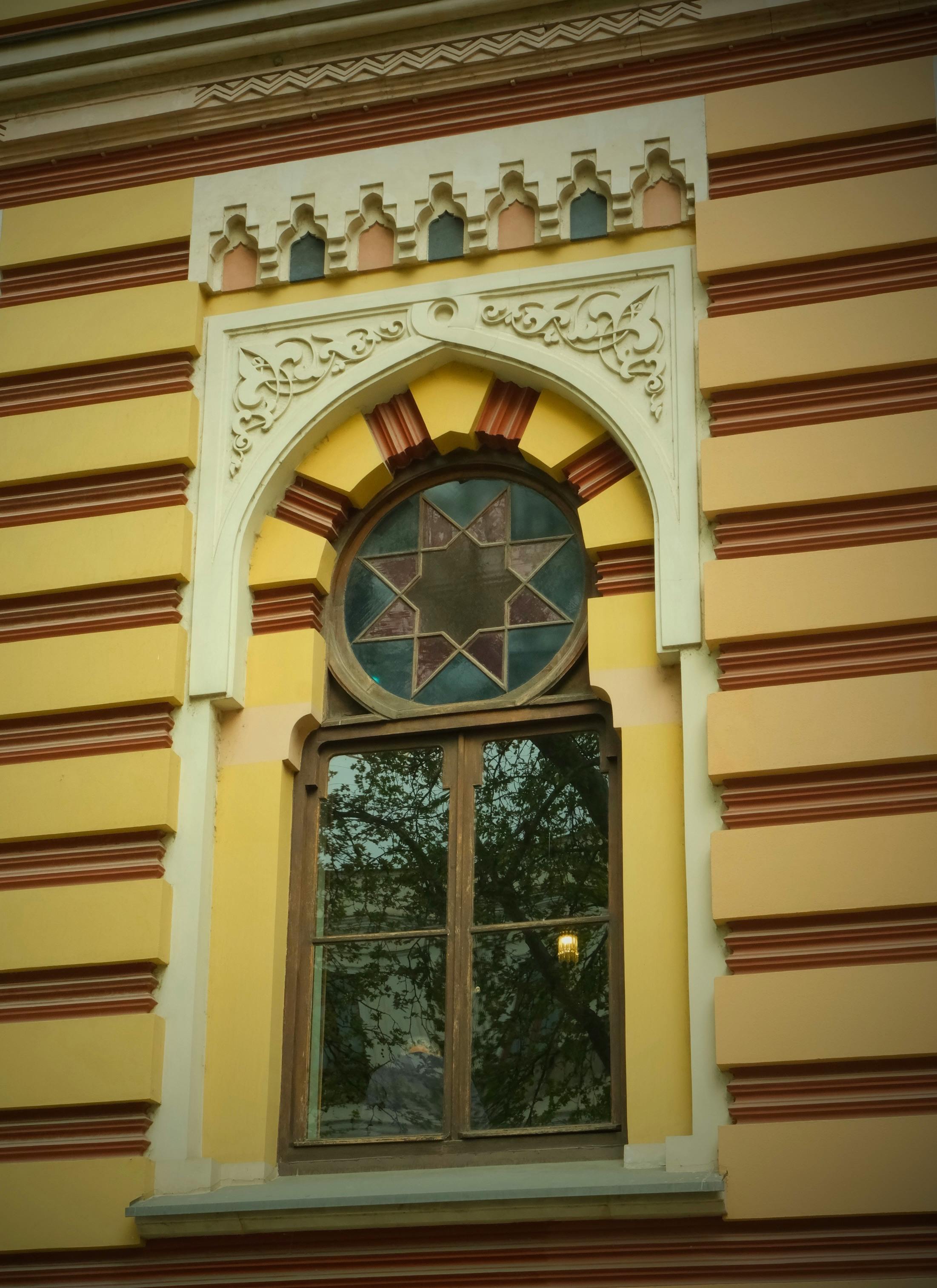 Ornate Arched Window with Stained Glass Star Detail · Free Stock Photo