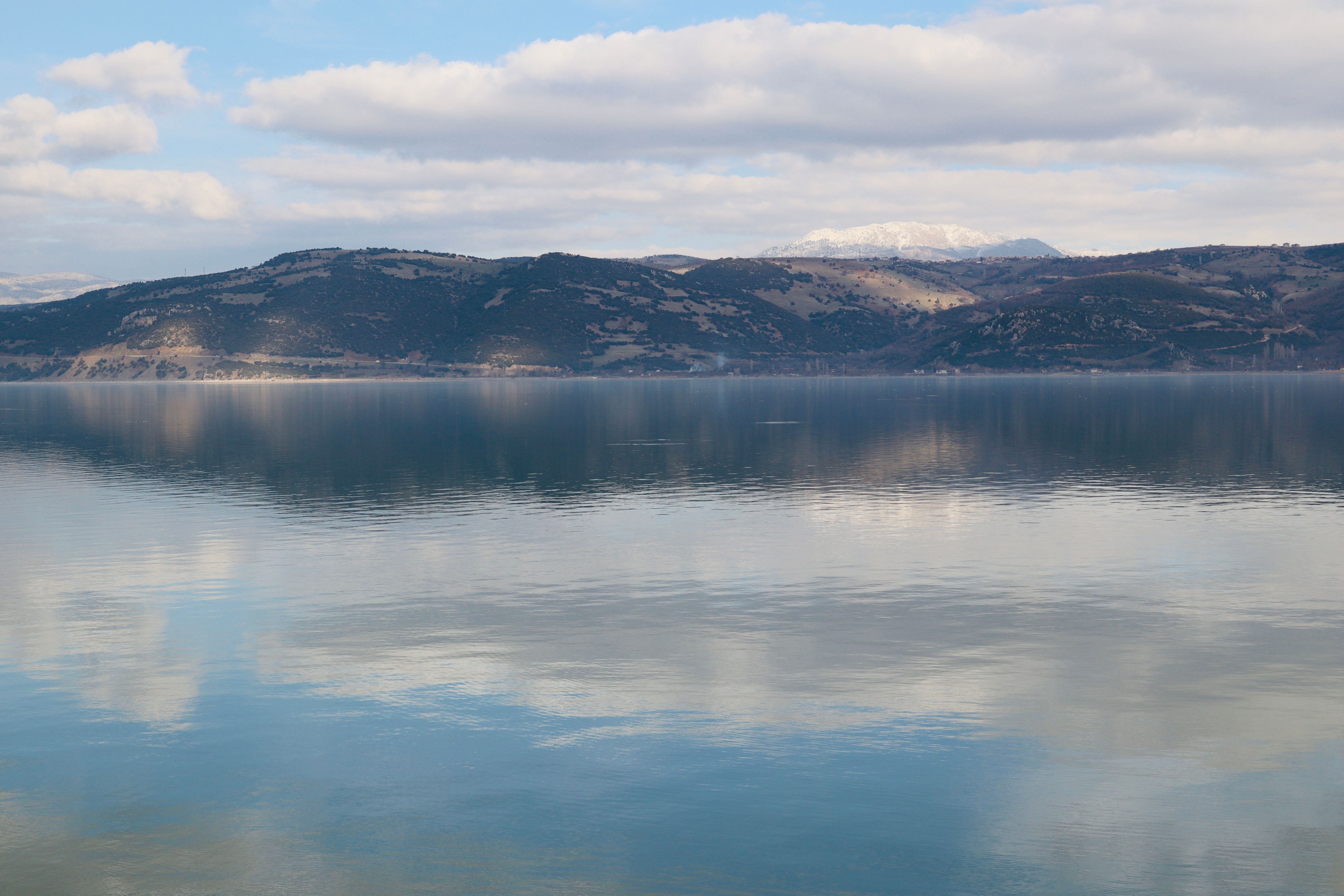 Scenic View of Mountains Across a Serene Lake · Free Stock Photo