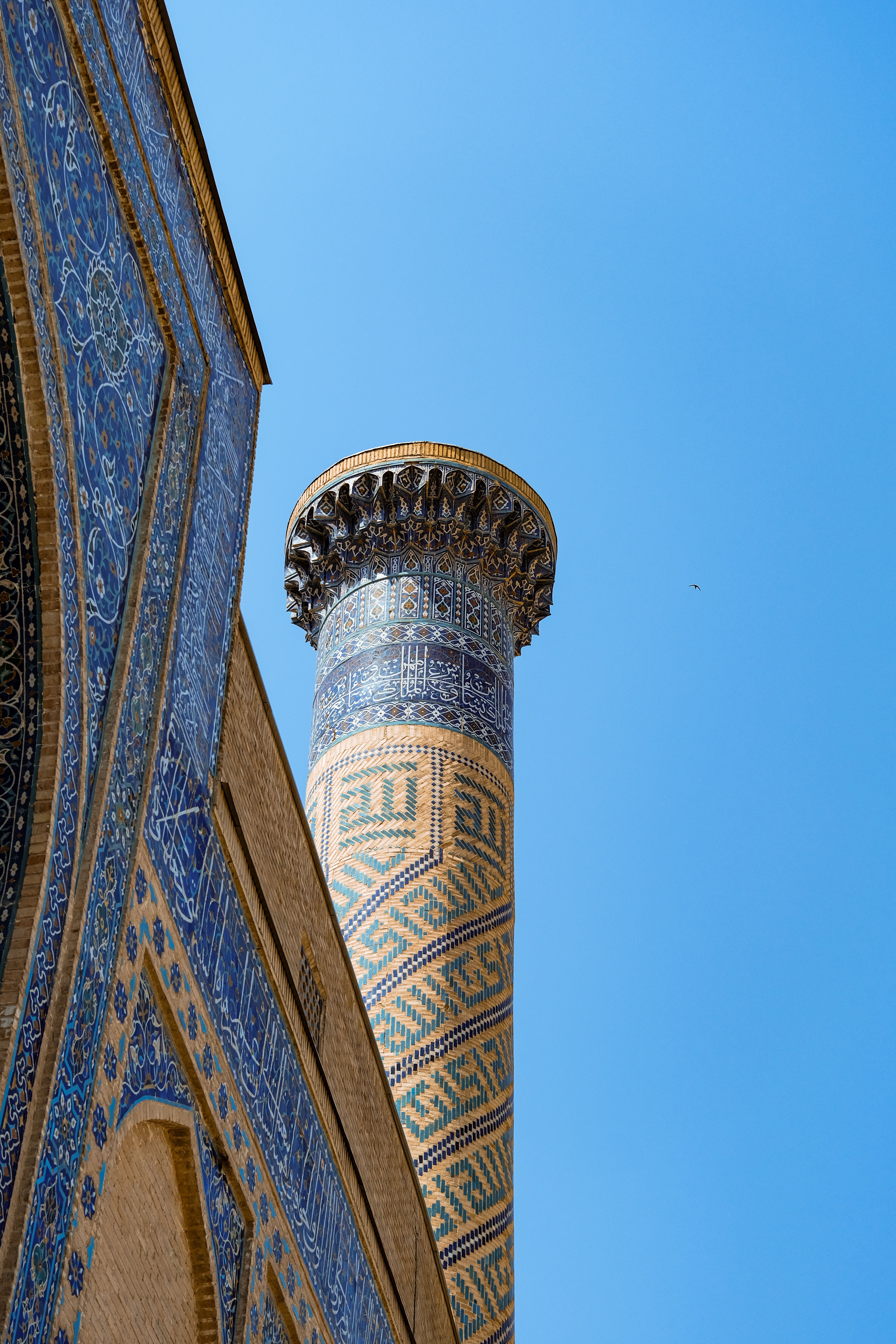 Intricate Tilework of Samarkand Minaret Under Blue Sky · Free Stock Photo