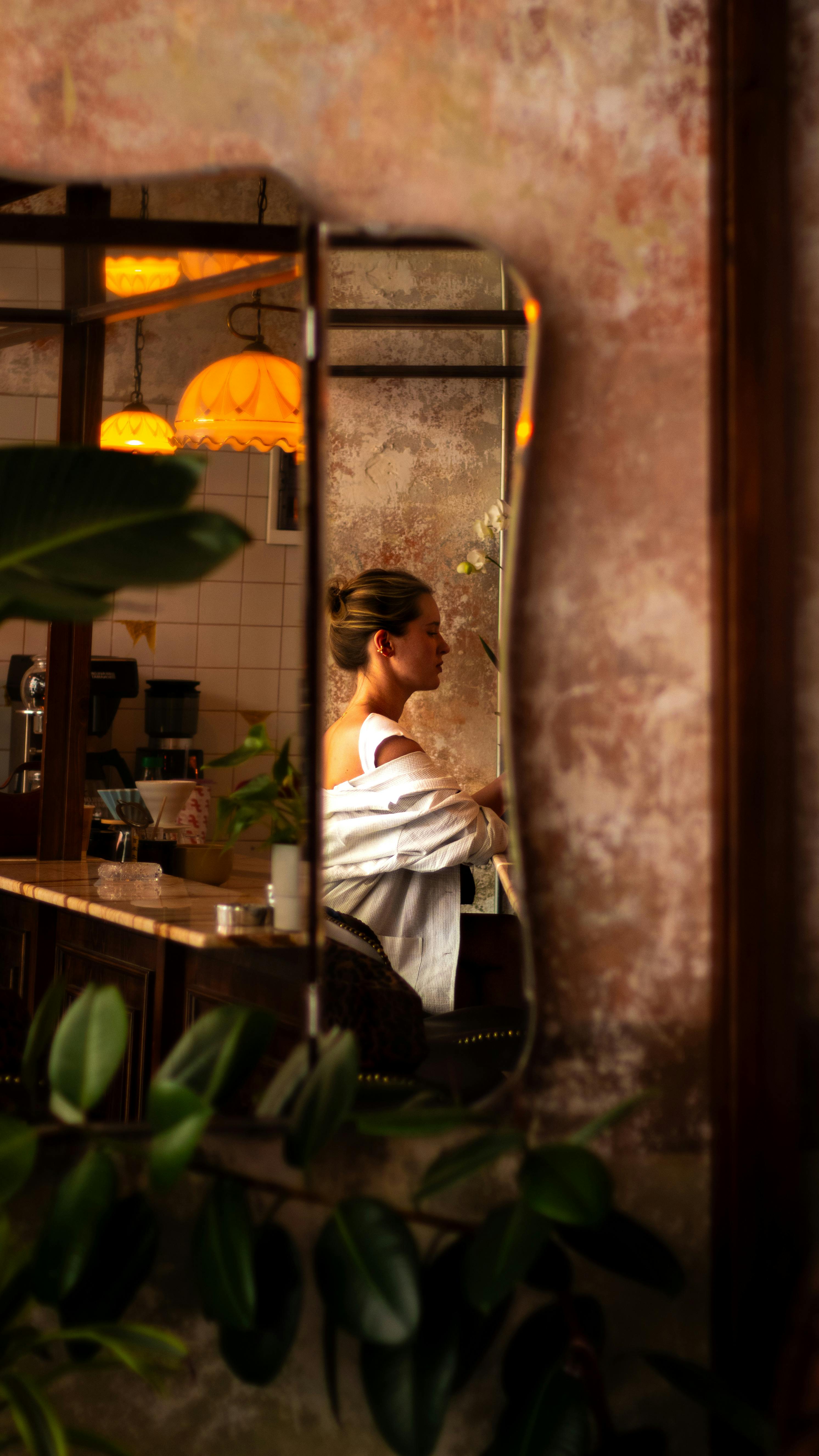 Elegant Woman Reflected in Vintage Cafe Mirror · Free Stock Photo