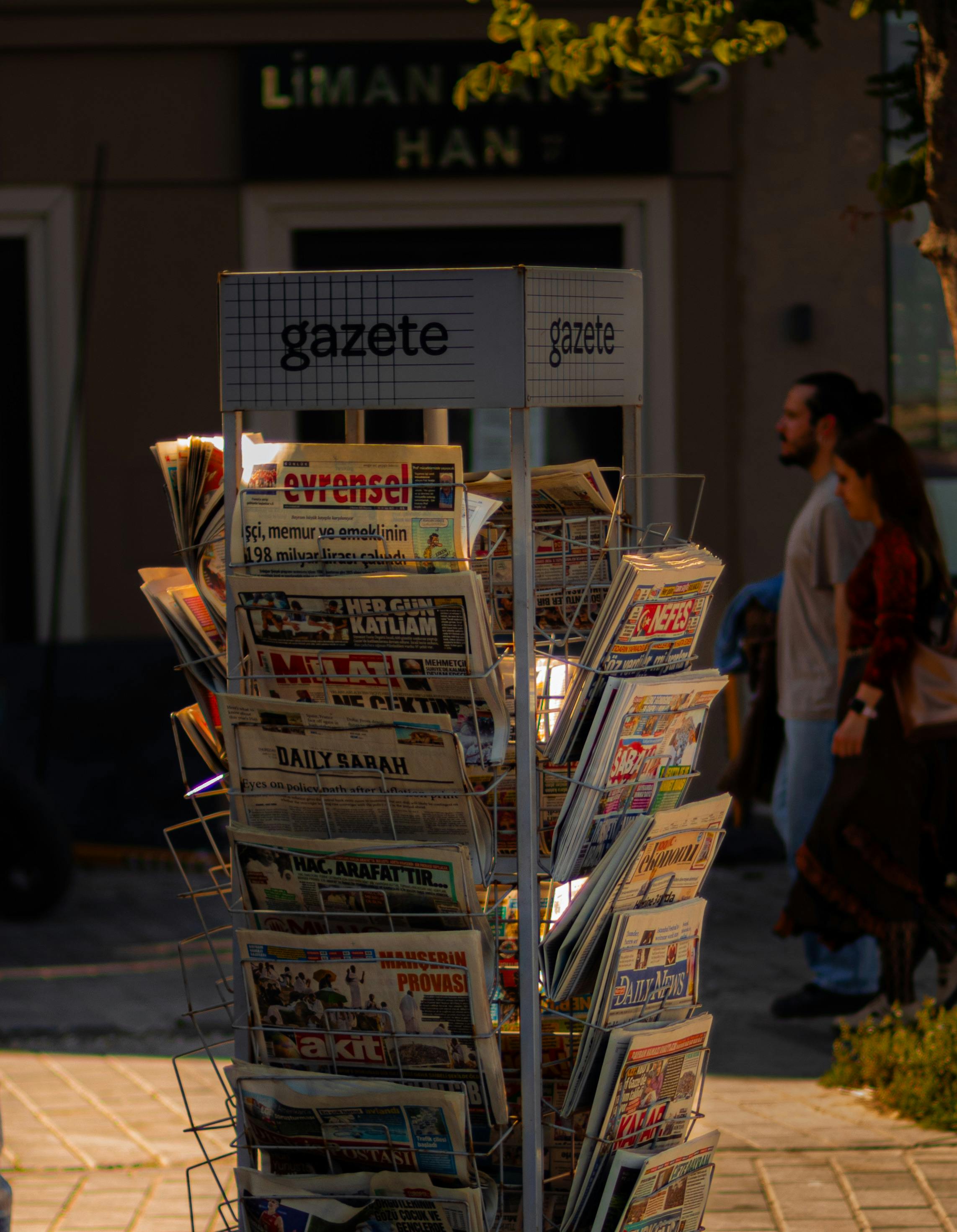 Outdoor Newspaper Stand on a Sunny Day · Free Stock Photo