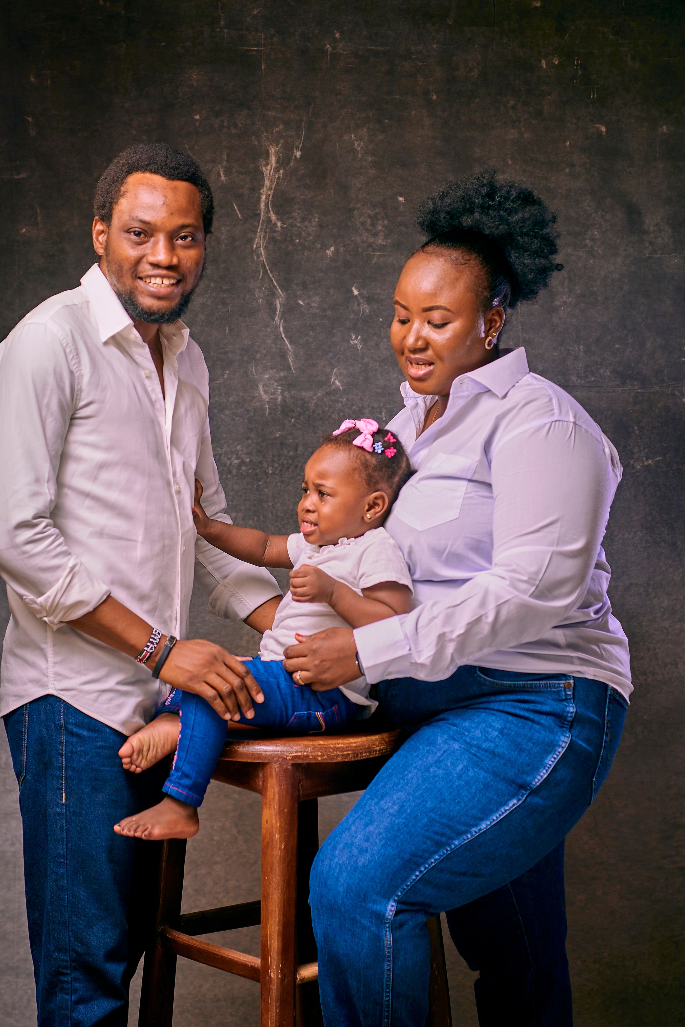 Happy Family Portrait in Studio Setting · Free Stock Photo