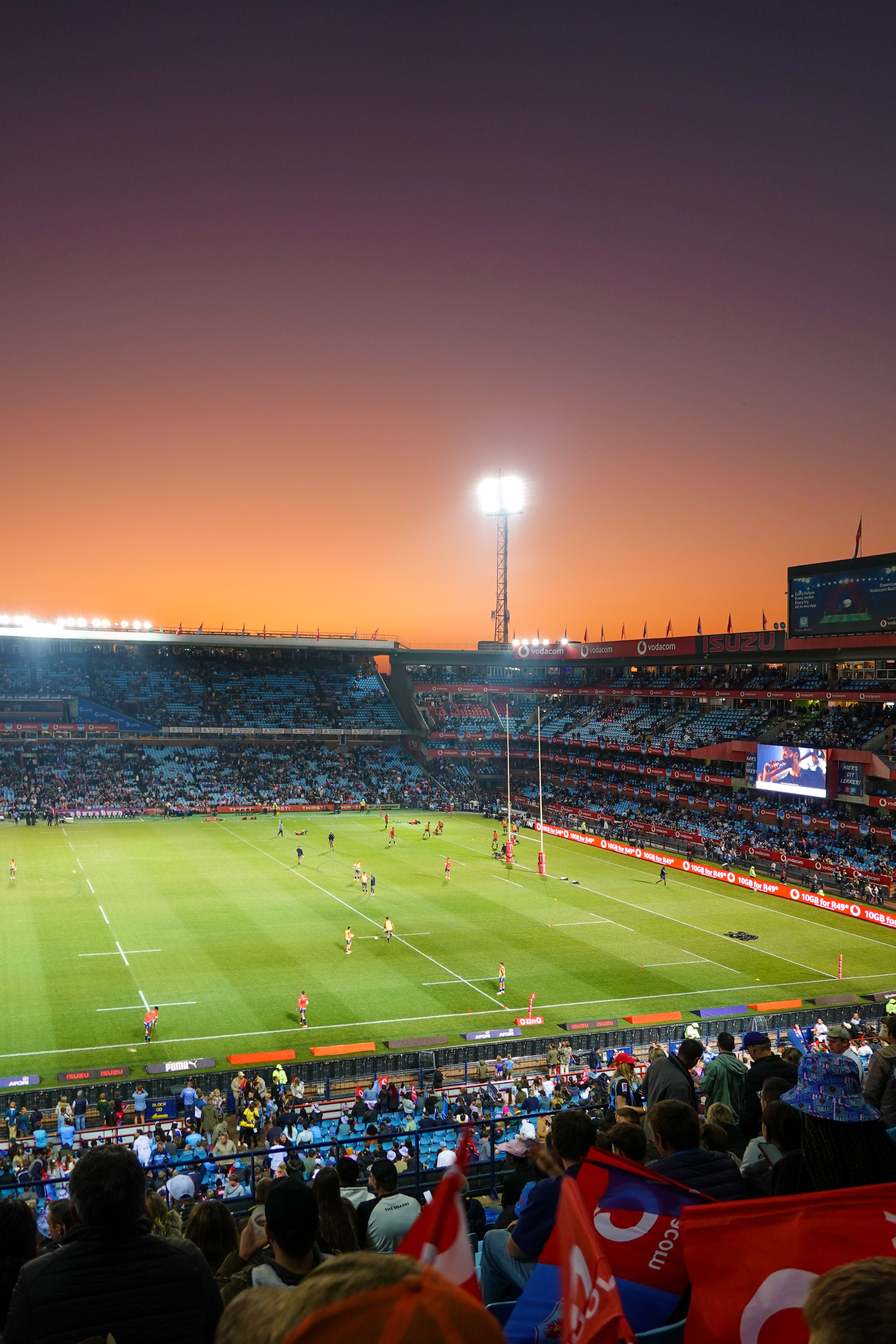 Cricket match at vibrant outdoor stadium · Free Stock Photo