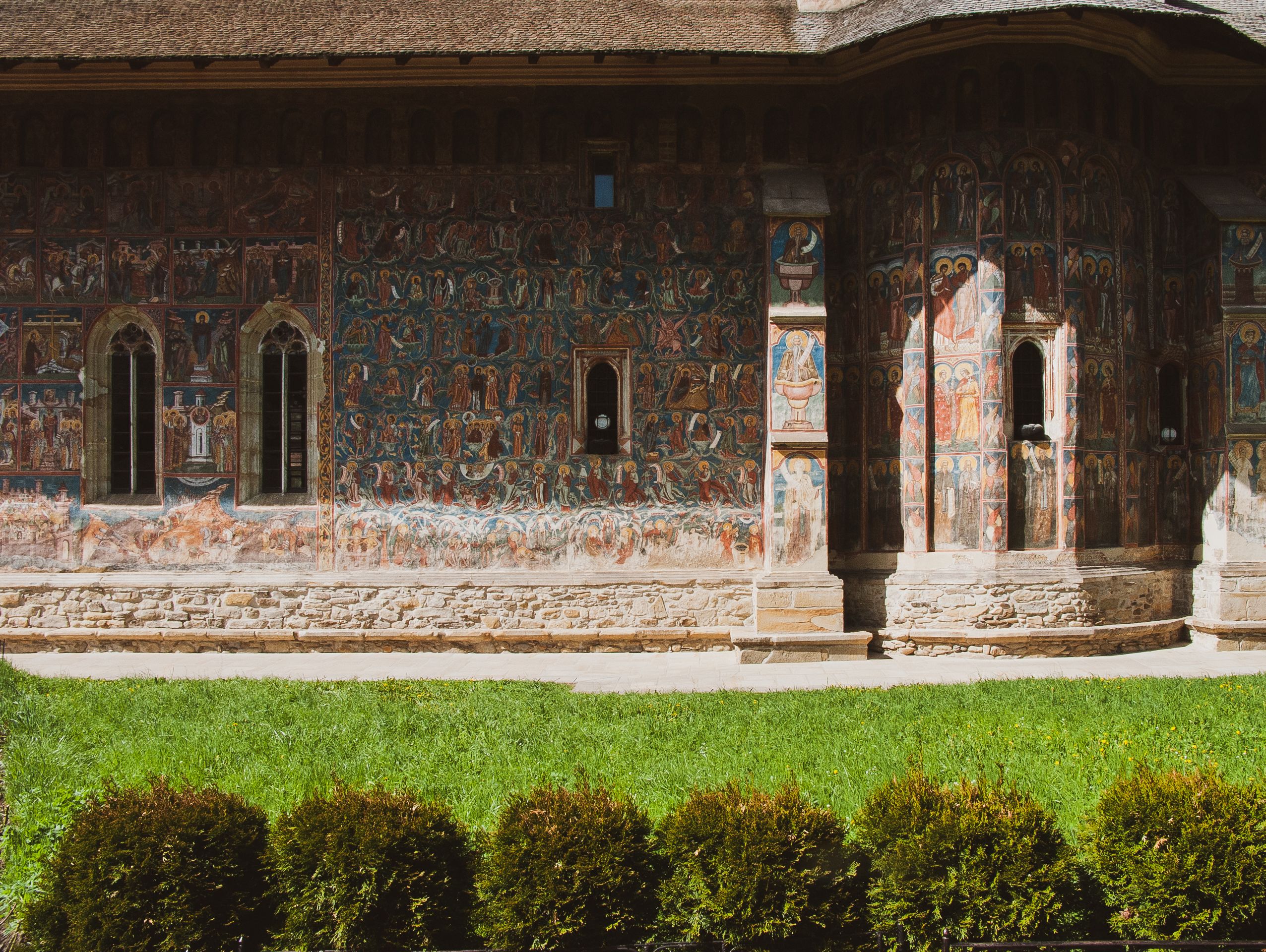 Historic Painted Monastery Wall with Frescoes · Free Stock Photo