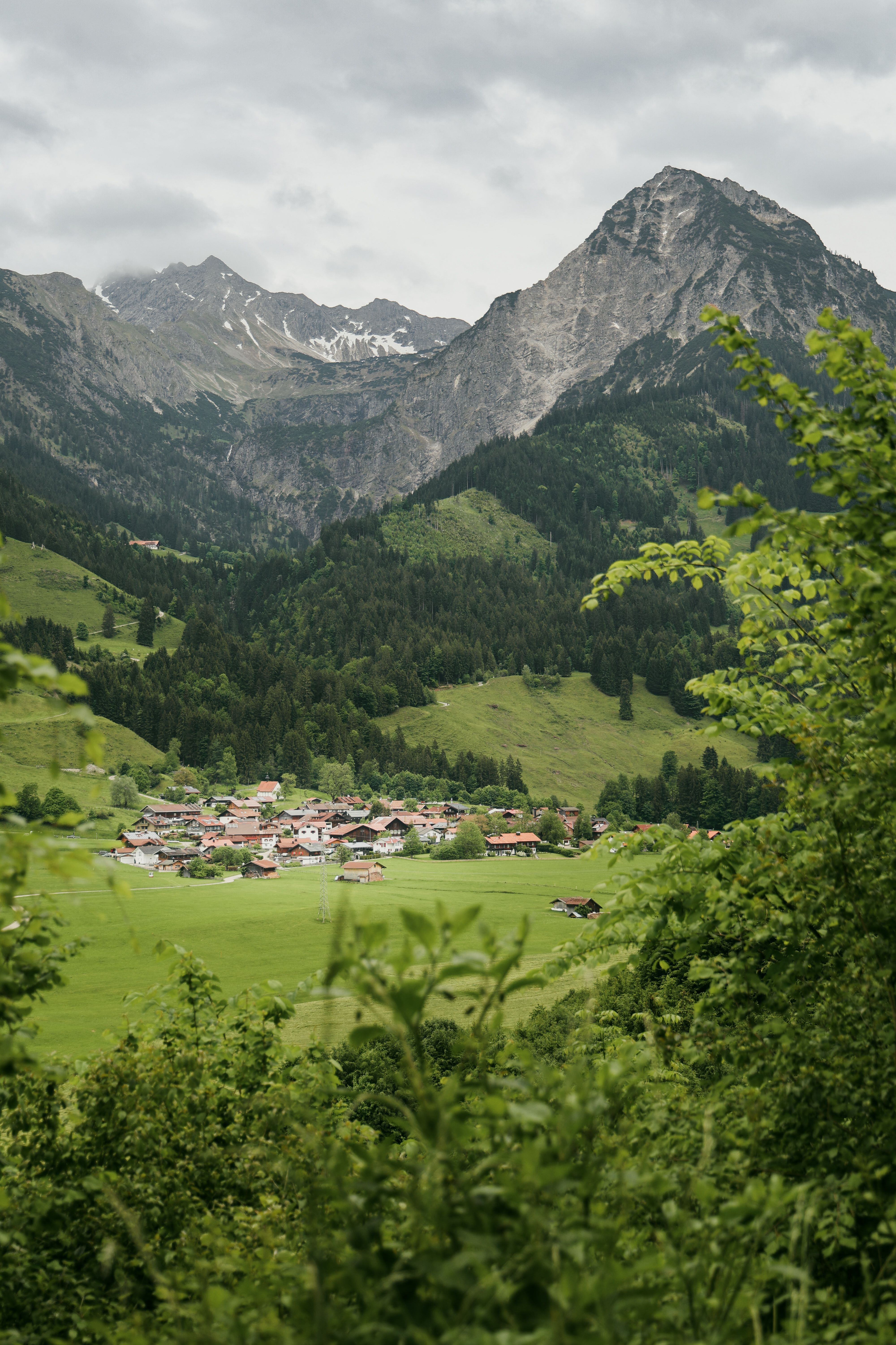 Picturesque Bavarian Village Amidst Alpine Mountains · Free Stock Photo
