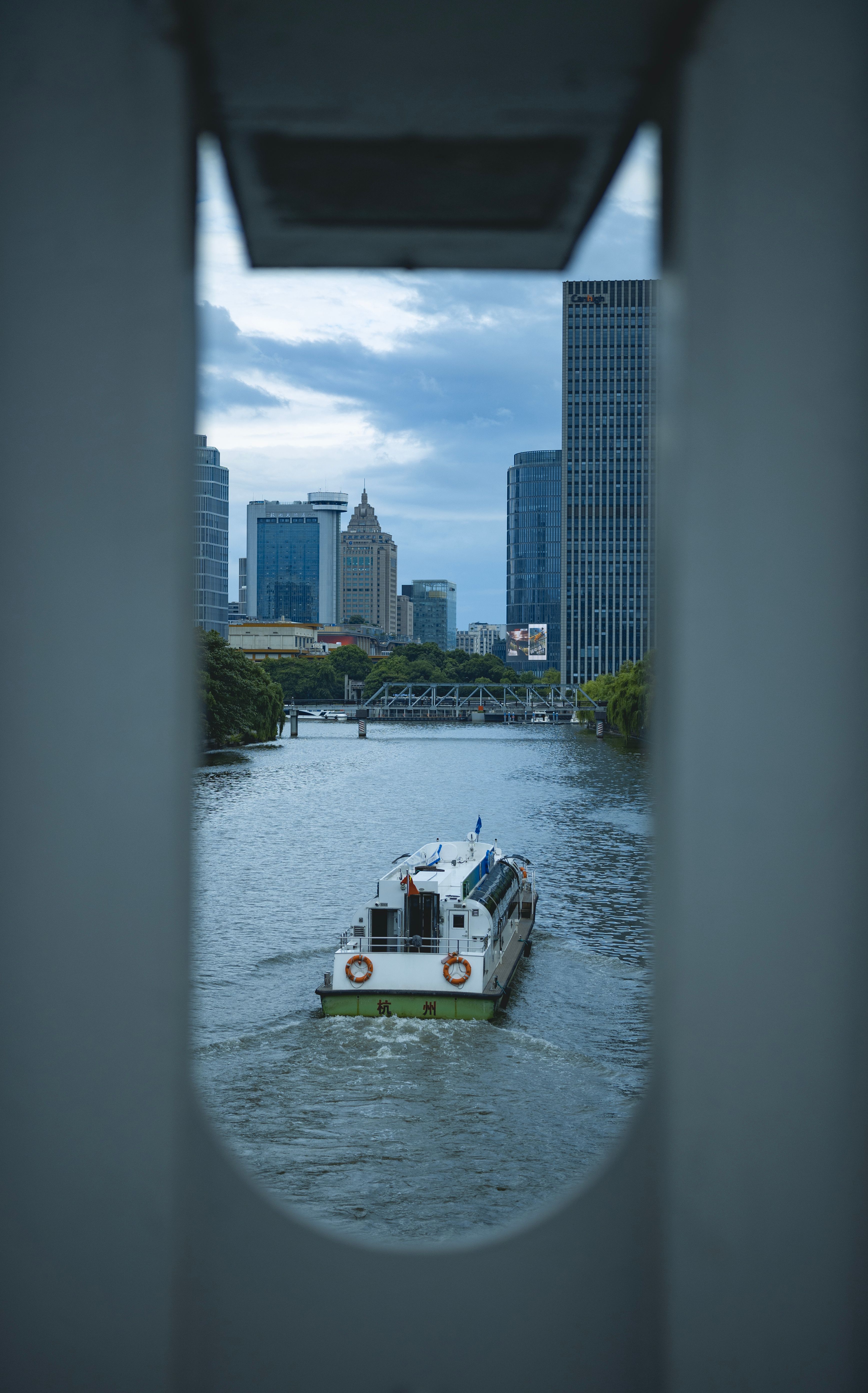Urban River View with Boat and Skyscrapers Framed · Free Stock Photo
