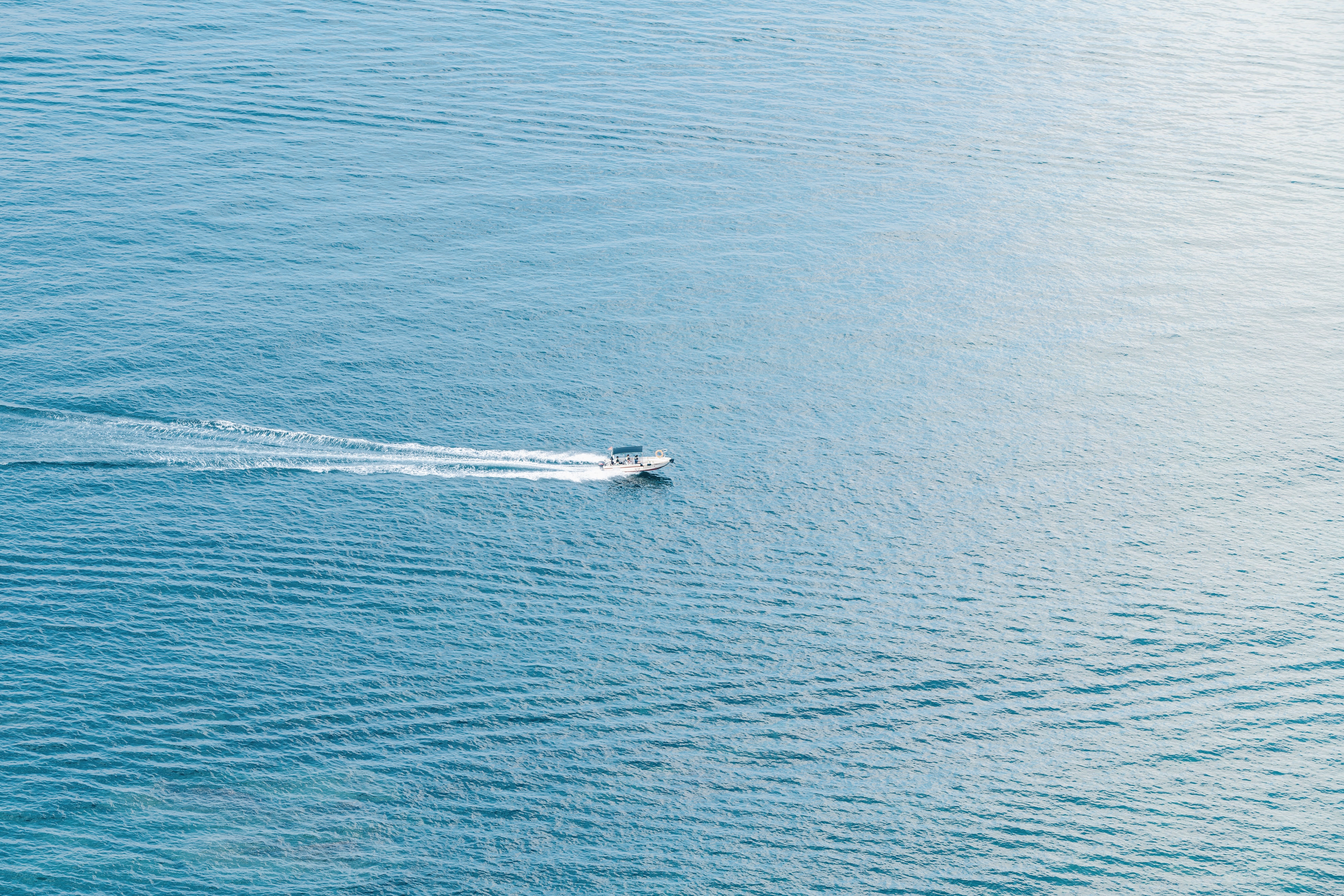 Aerial View of Boat on Open Blue Sea · Free Stock Photo