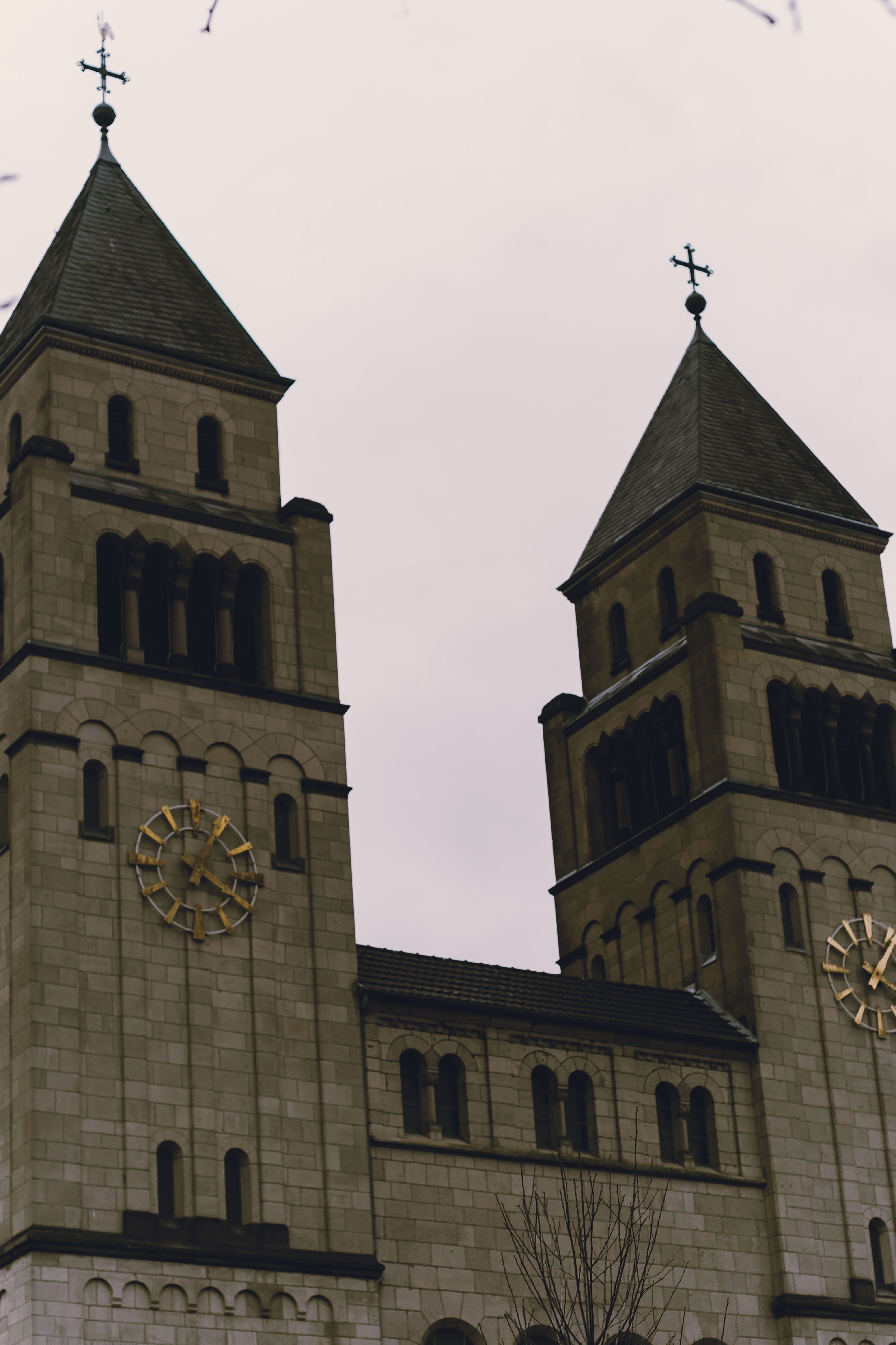 Gothic Stone Church Towers with Clocks · Free Stock Photo