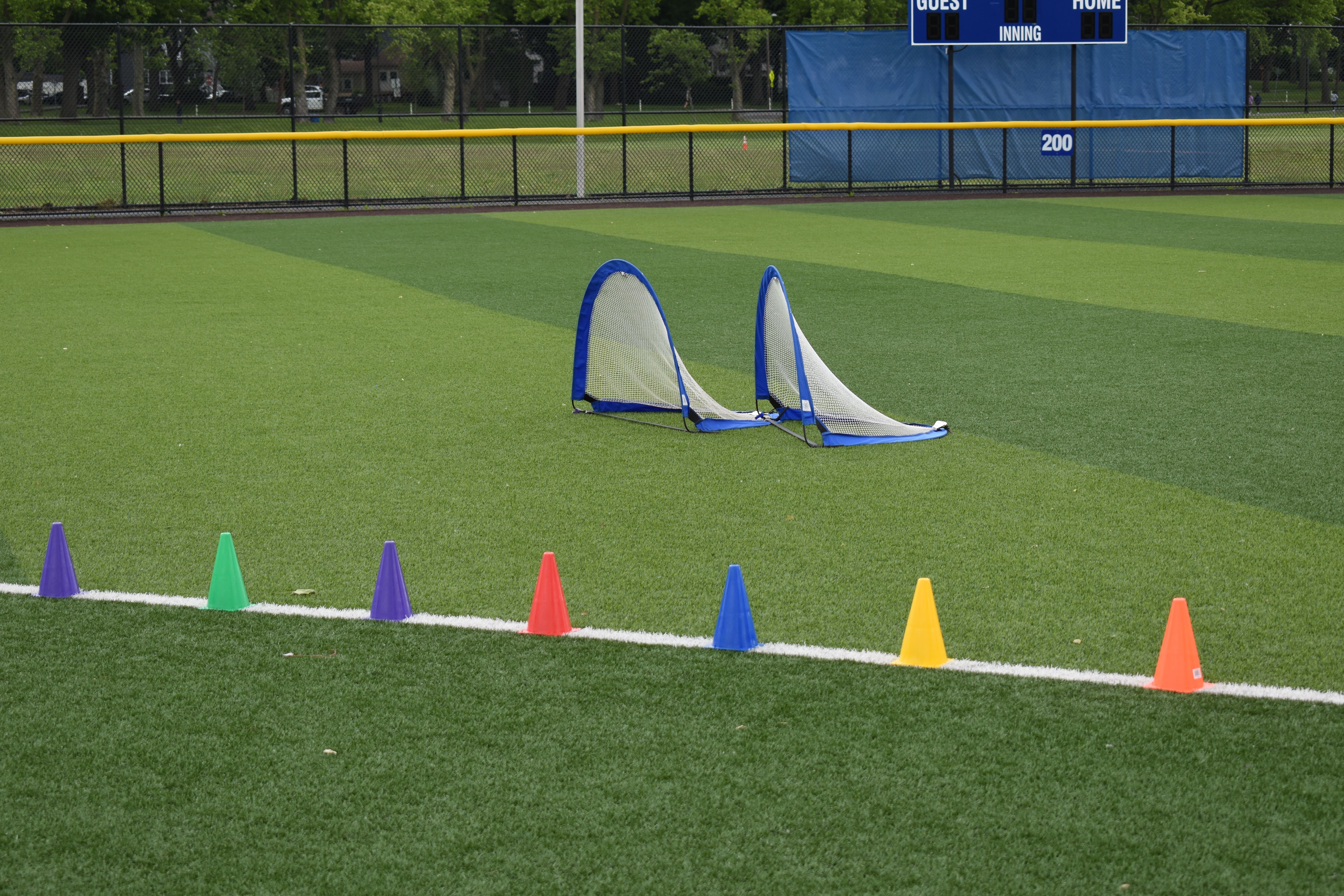 Outdoor Sports Field with Training Cones and Nets · Free Stock Photo