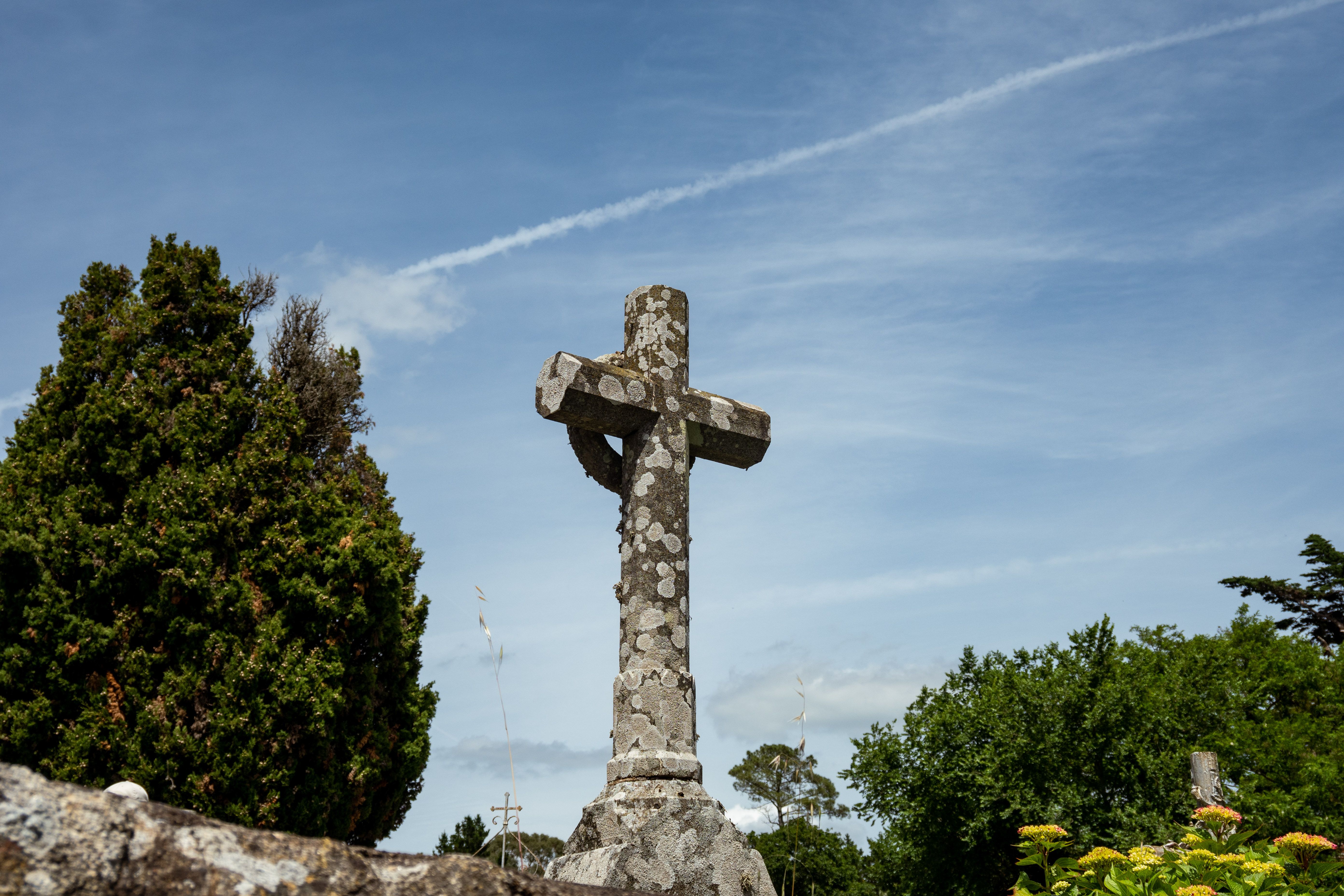 Stone Cross in Breton Cemetery Under Blue Sky · Free Stock Photo