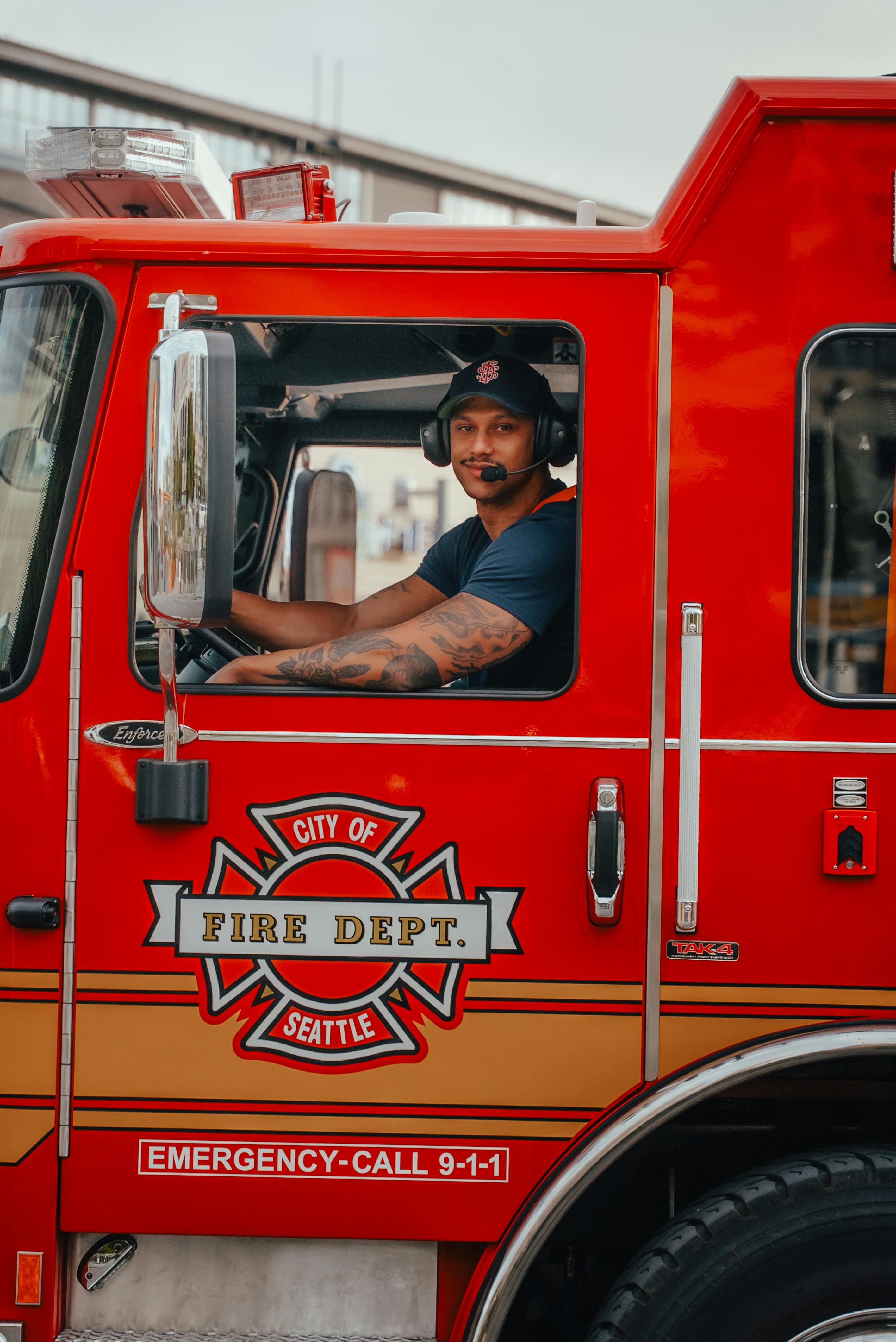 Seattle Firefighter Driving Fire Truck · Free Stock Photo