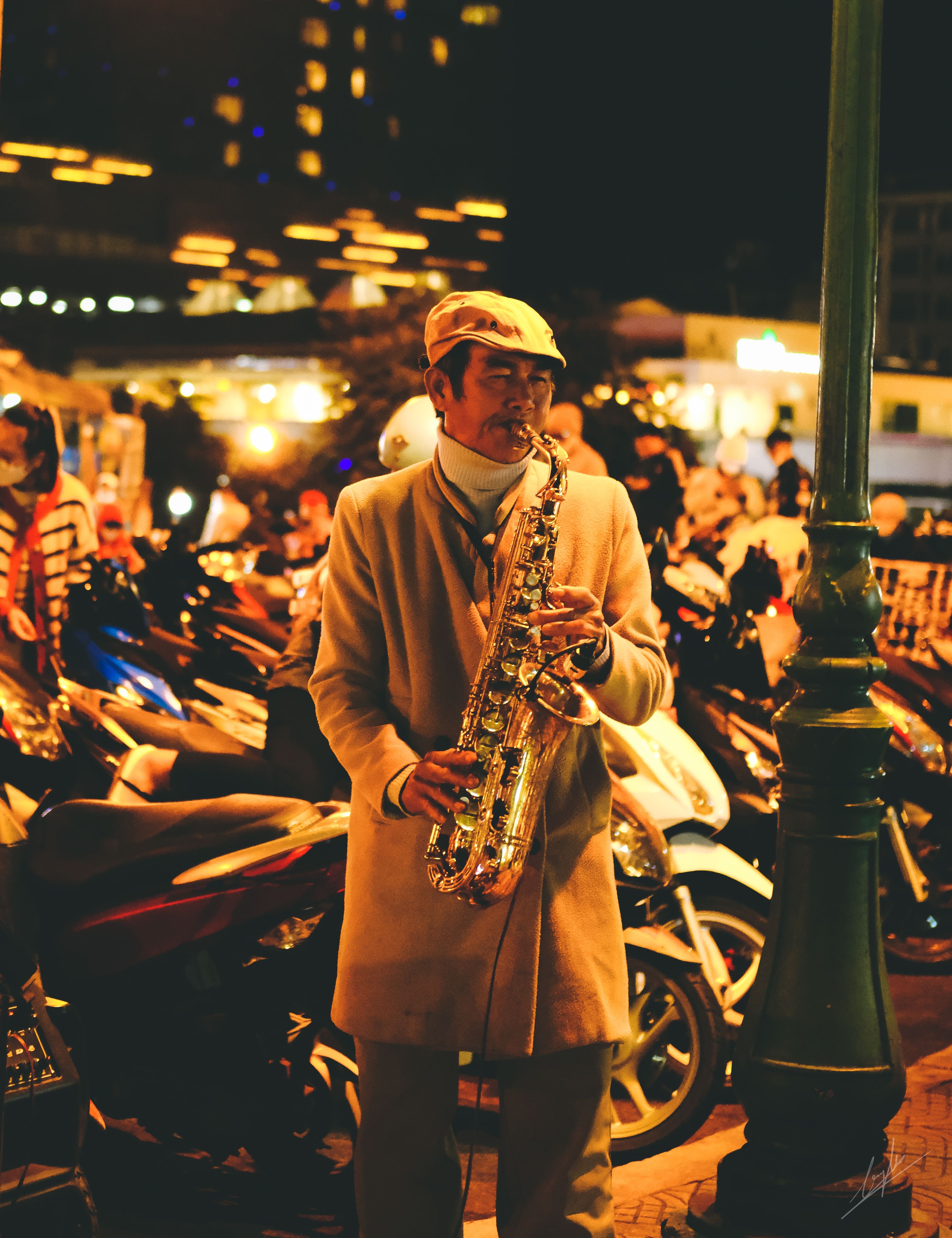 Street Musician Playing Saxophone at Dalat Night Market · Free Stock Photo